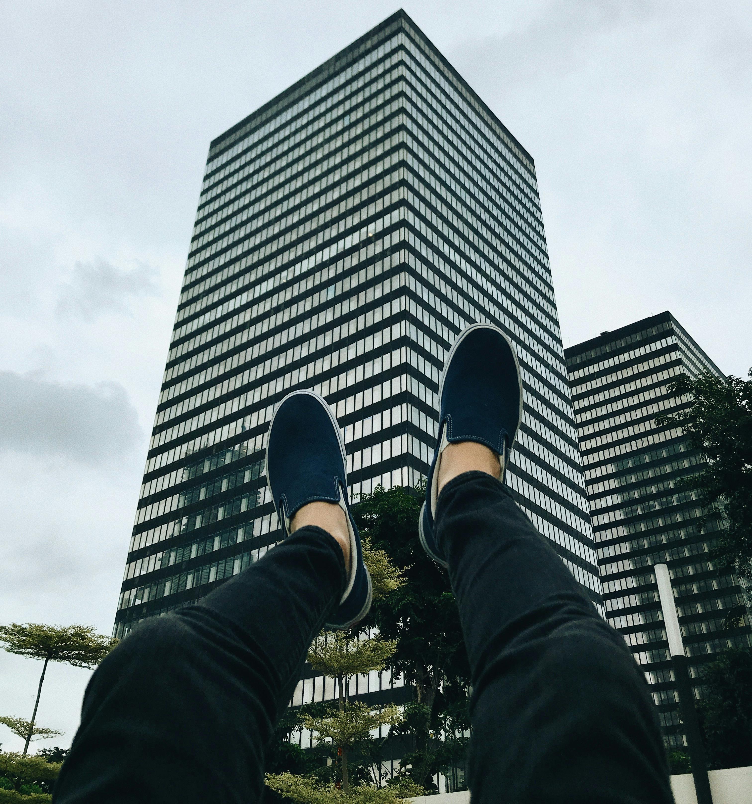 Point of View of a Person Raising Legs near a Building · Free Stock Photo