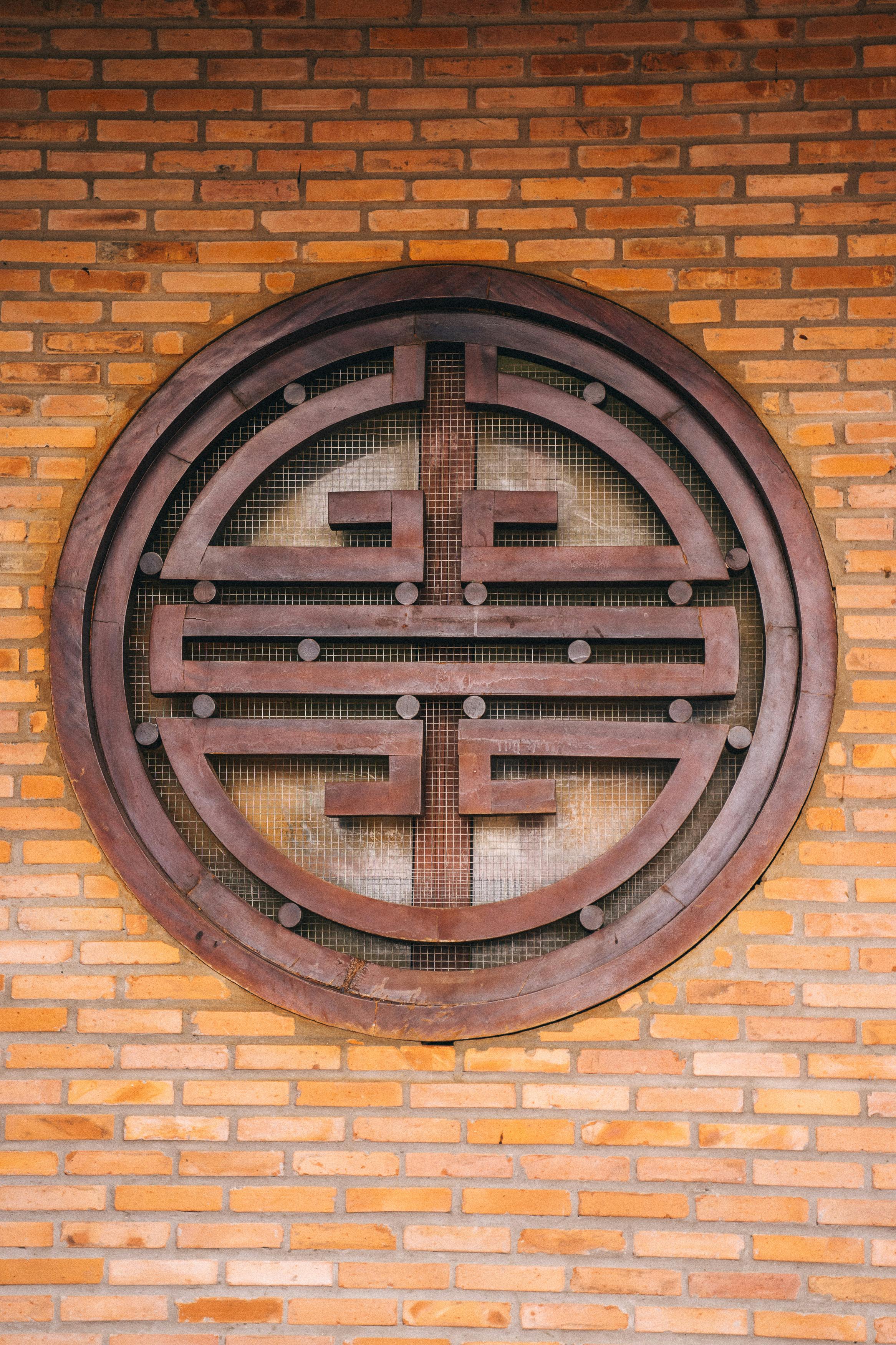 A Round Window on Brick Wall · Free Stock Photo