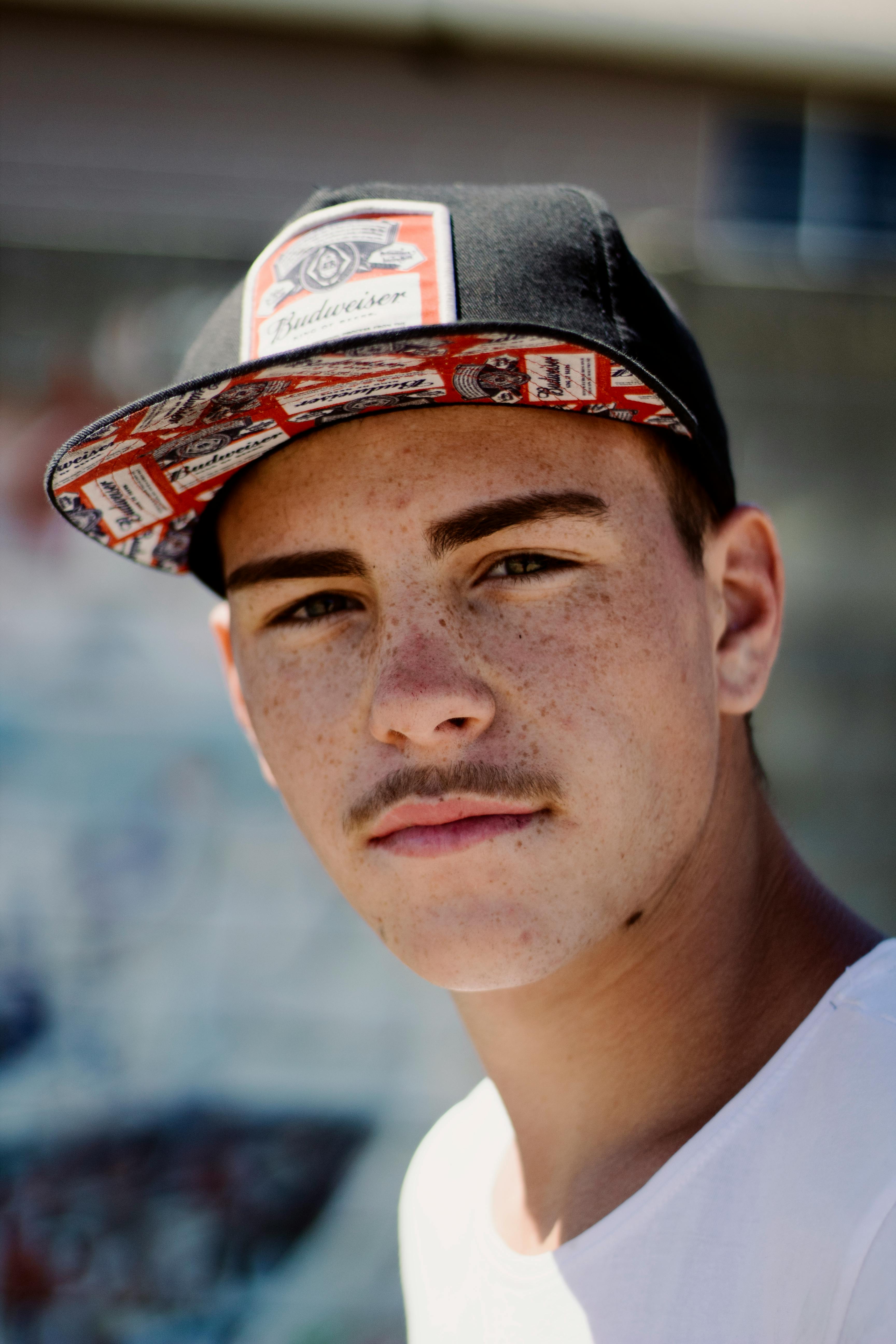 Serious man with freckles and mustache · Free Stock Photo