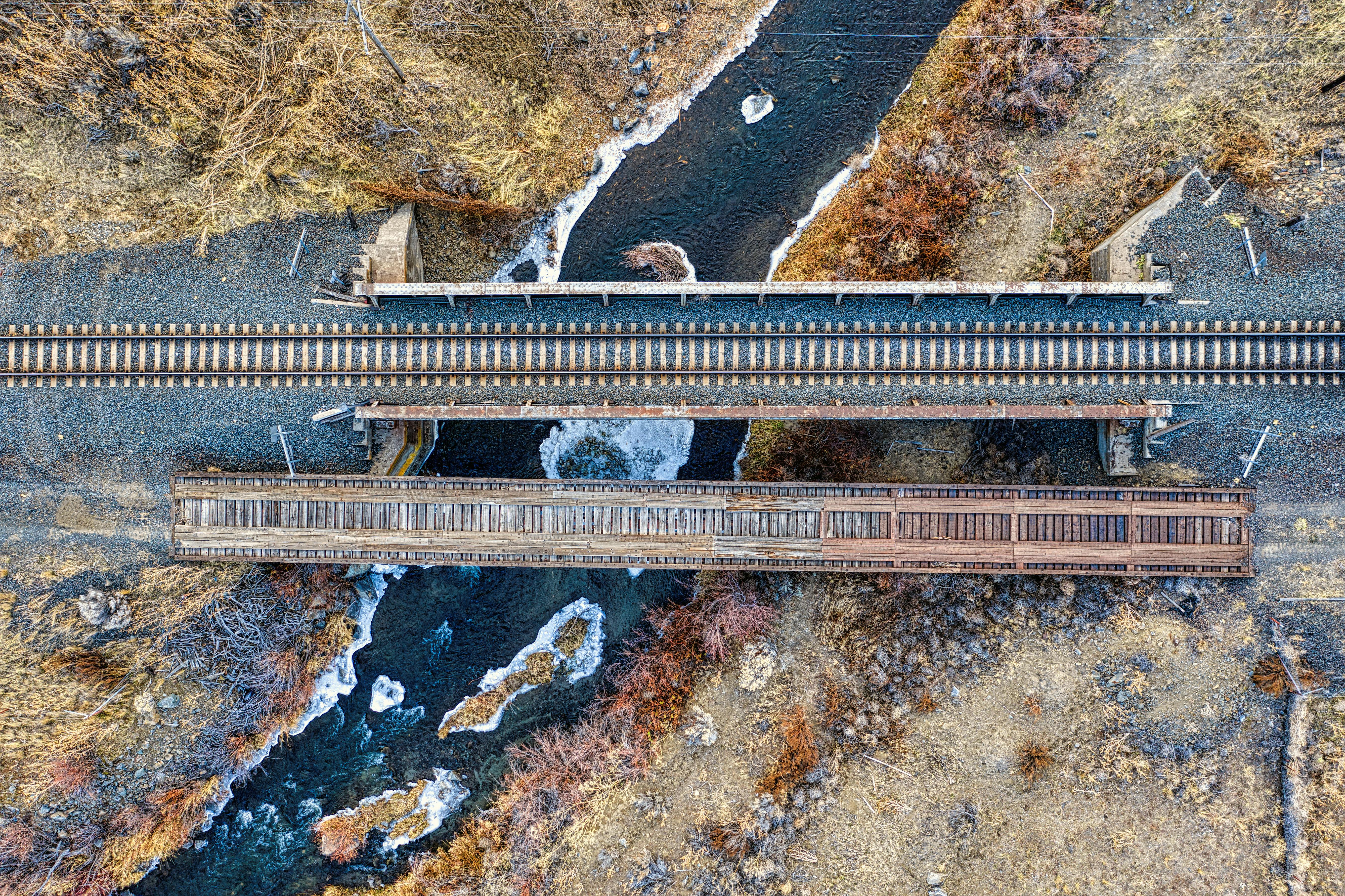 View of Train Rails Above River · Free Stock Photo