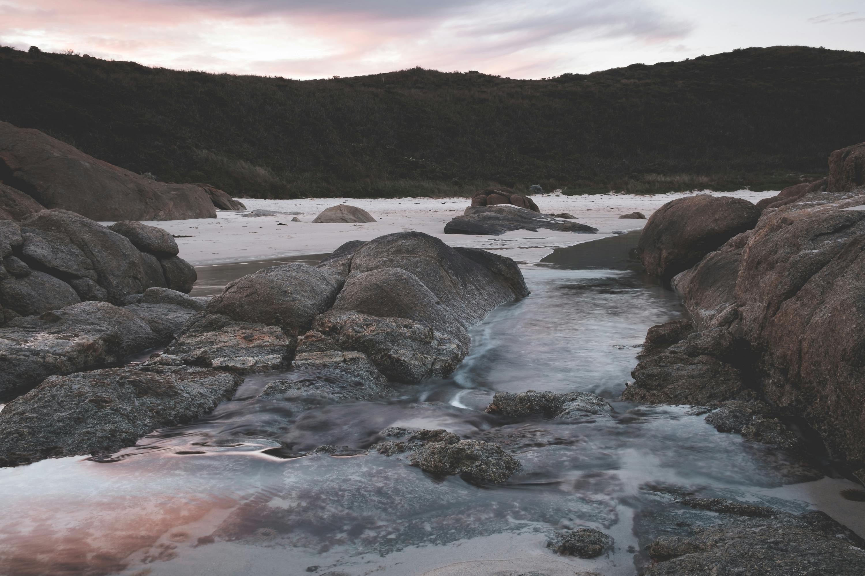 River washing heavy stones of embankment · Free Stock Photo