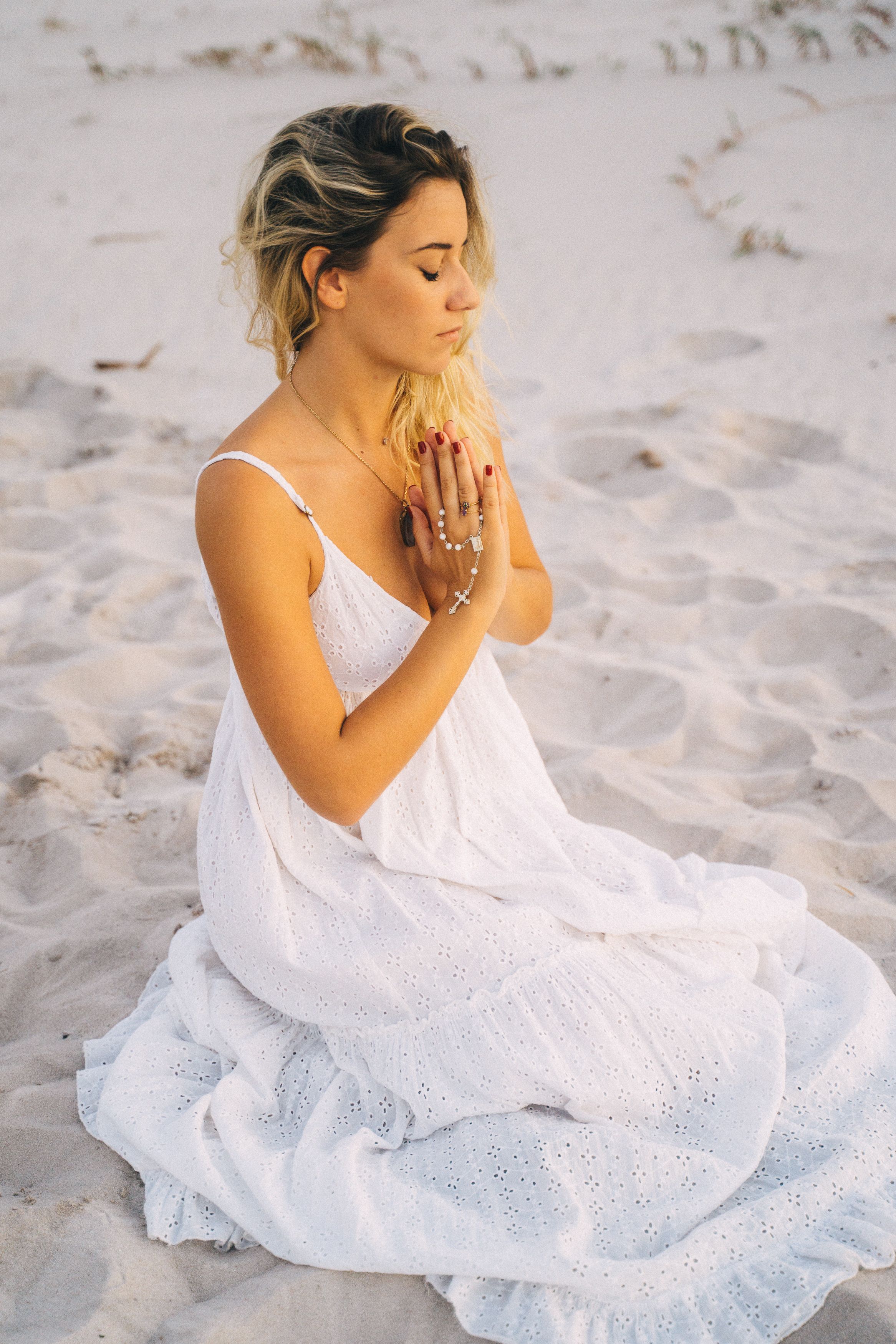 A Woman in White Dress Praying · Free Stock Photo