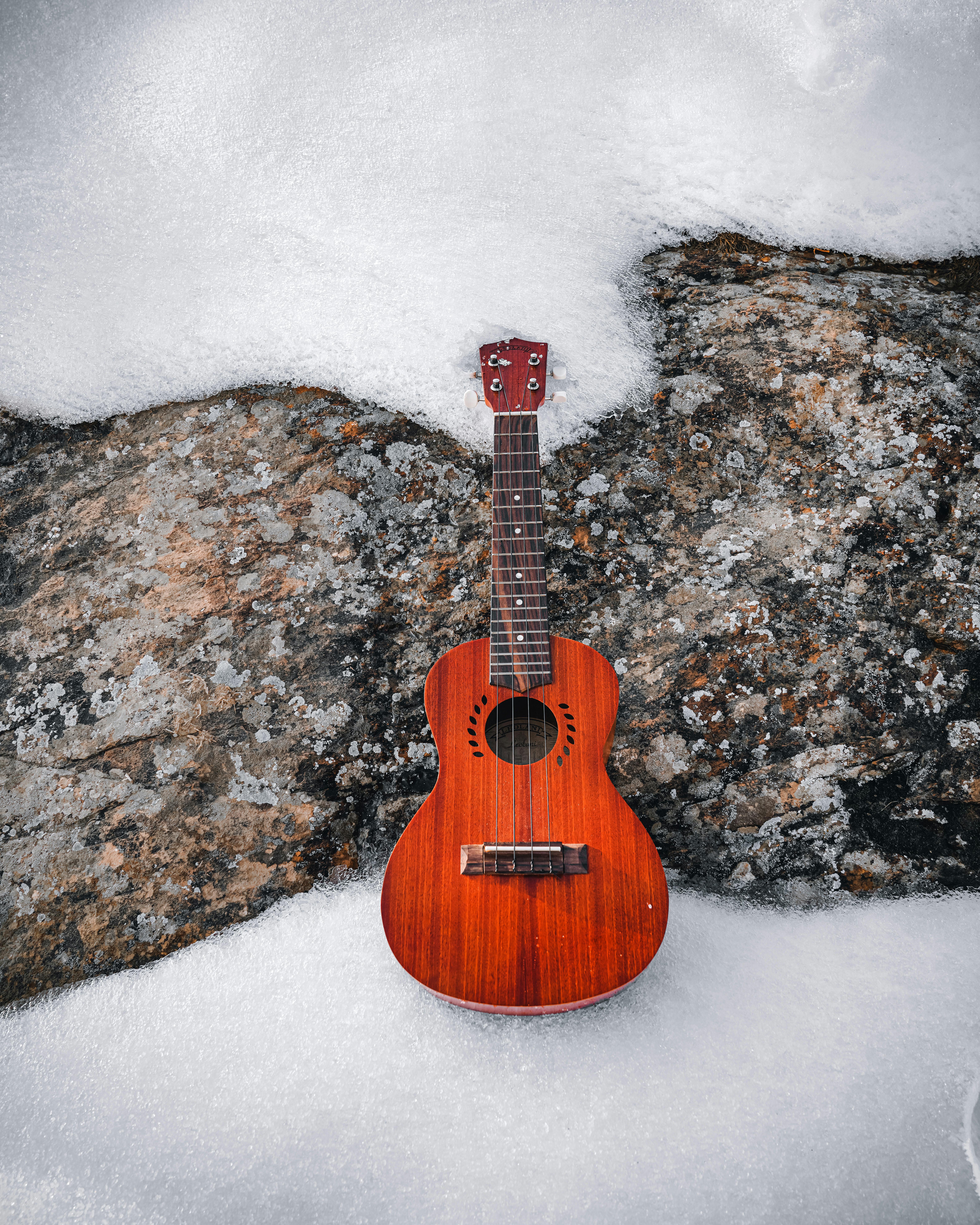 Overhead Shot of an Ukulele on Snowy Ground · Free Stock Photo