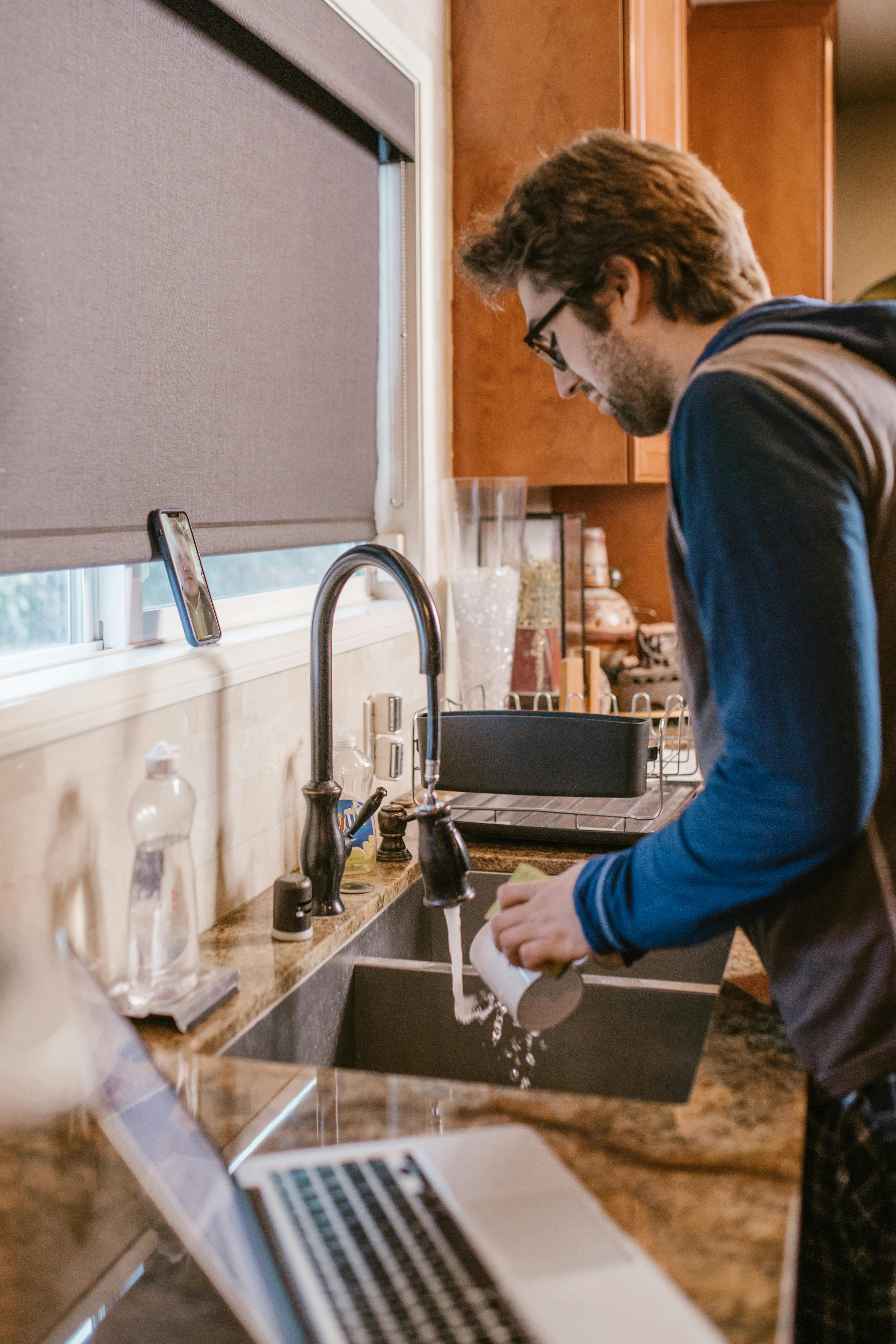Photo of a Man Washing a Mug · Free Stock Photo