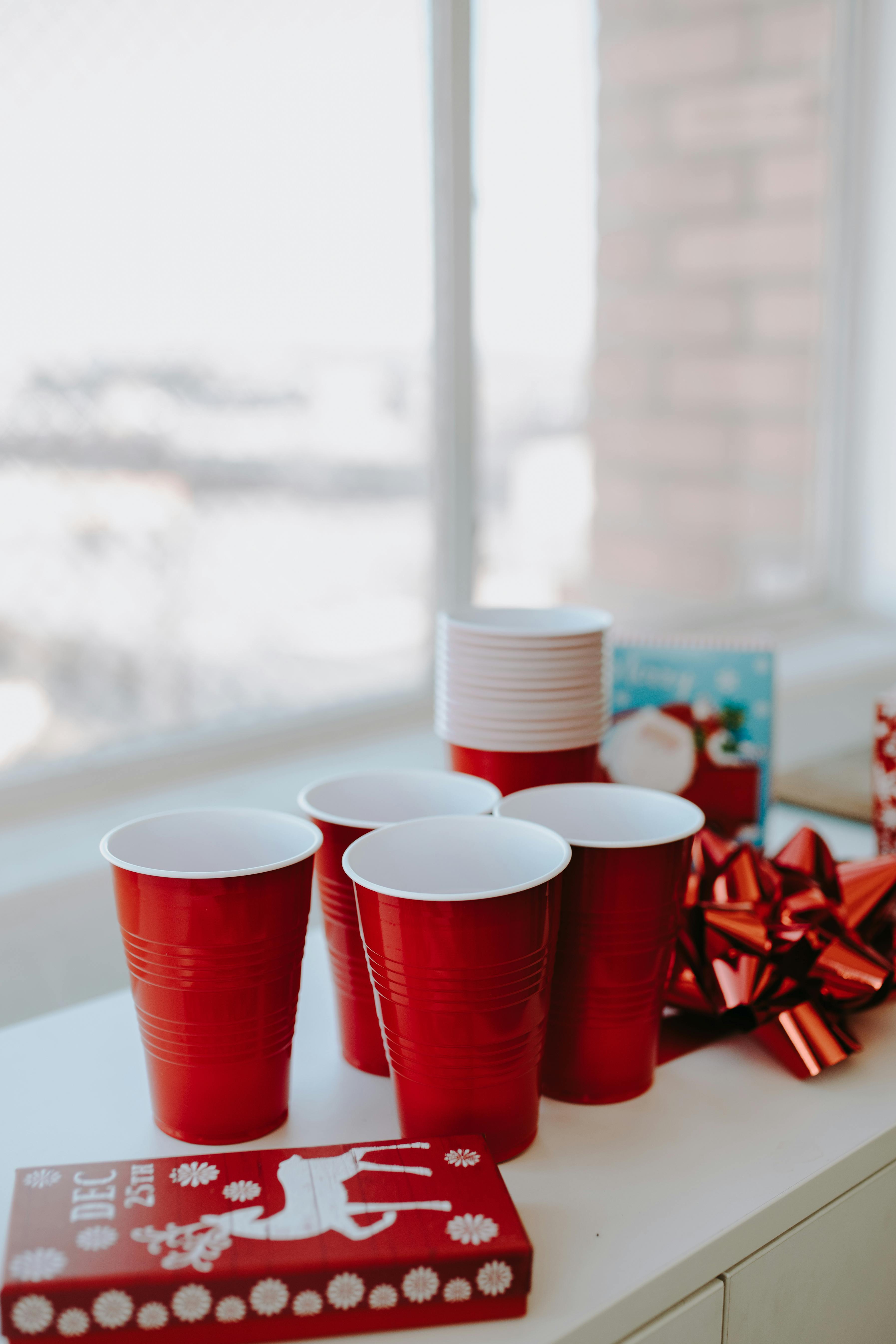 Red and White Plastic Cups on Table · Free Stock Photo