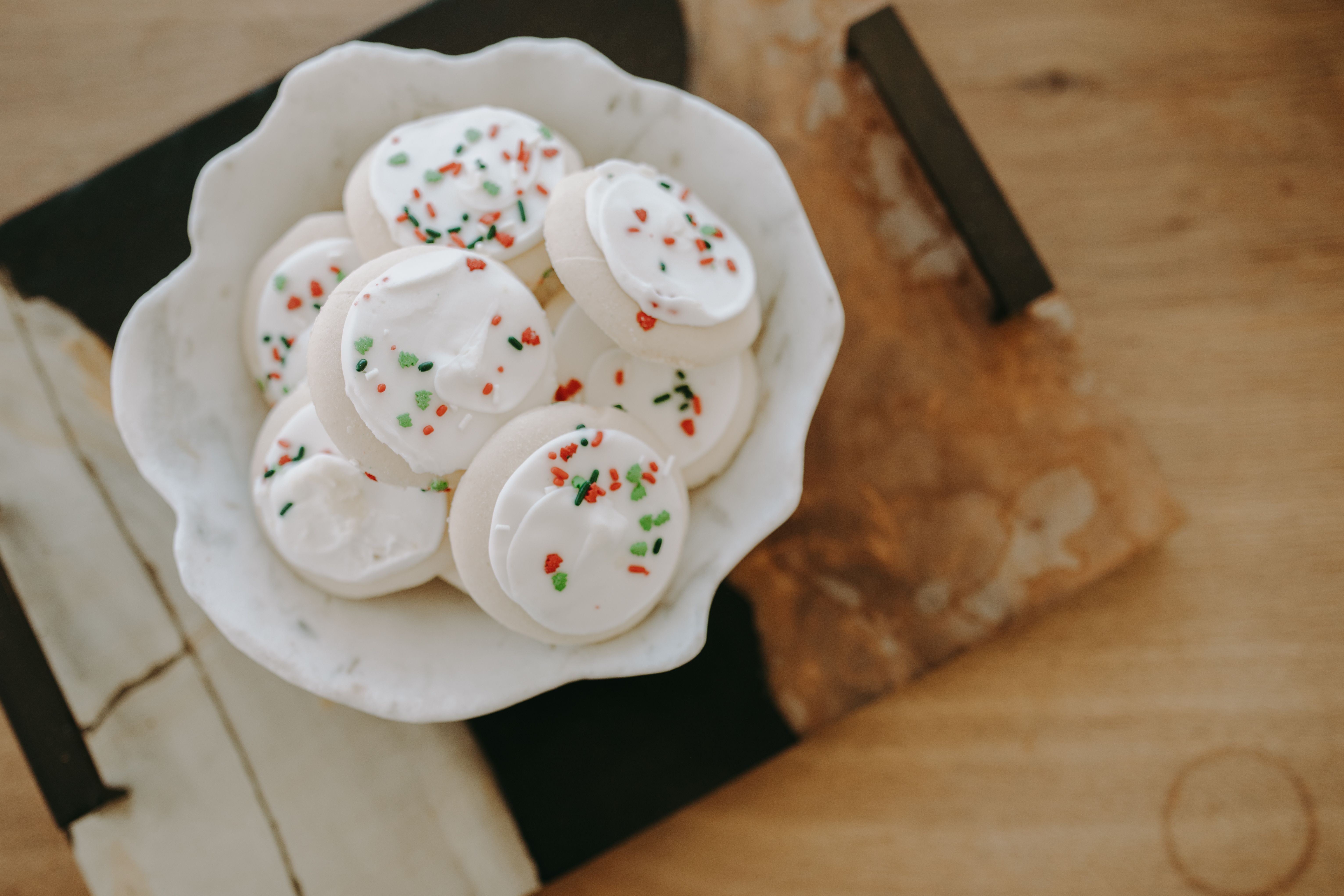 White Icing on Cookies in White Ceramic Bowl · Free Stock Photo