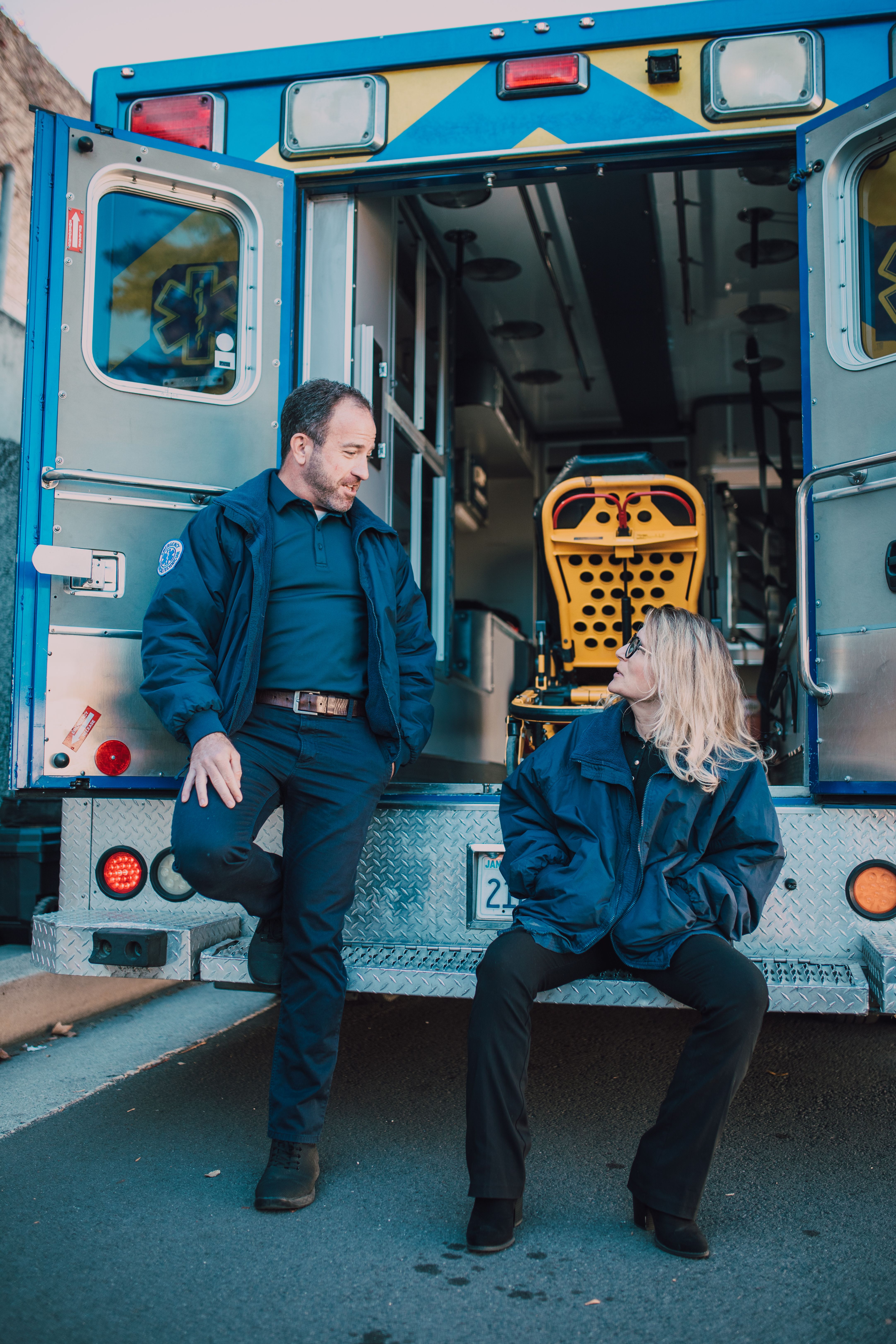 Paramedics Behind an Ambulance · Free Stock Photo