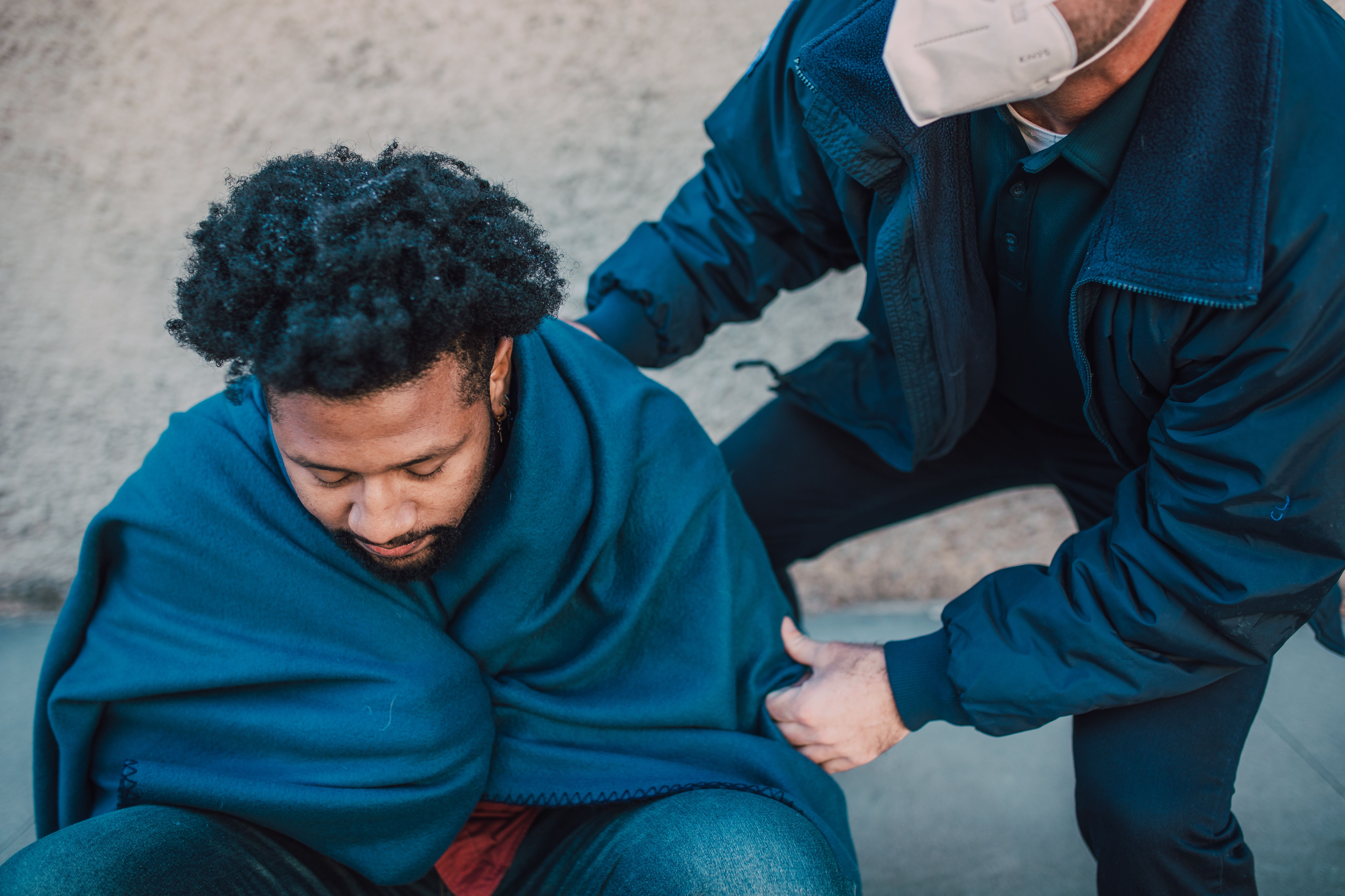 Paramedic Helping a Man · Free Stock Photo