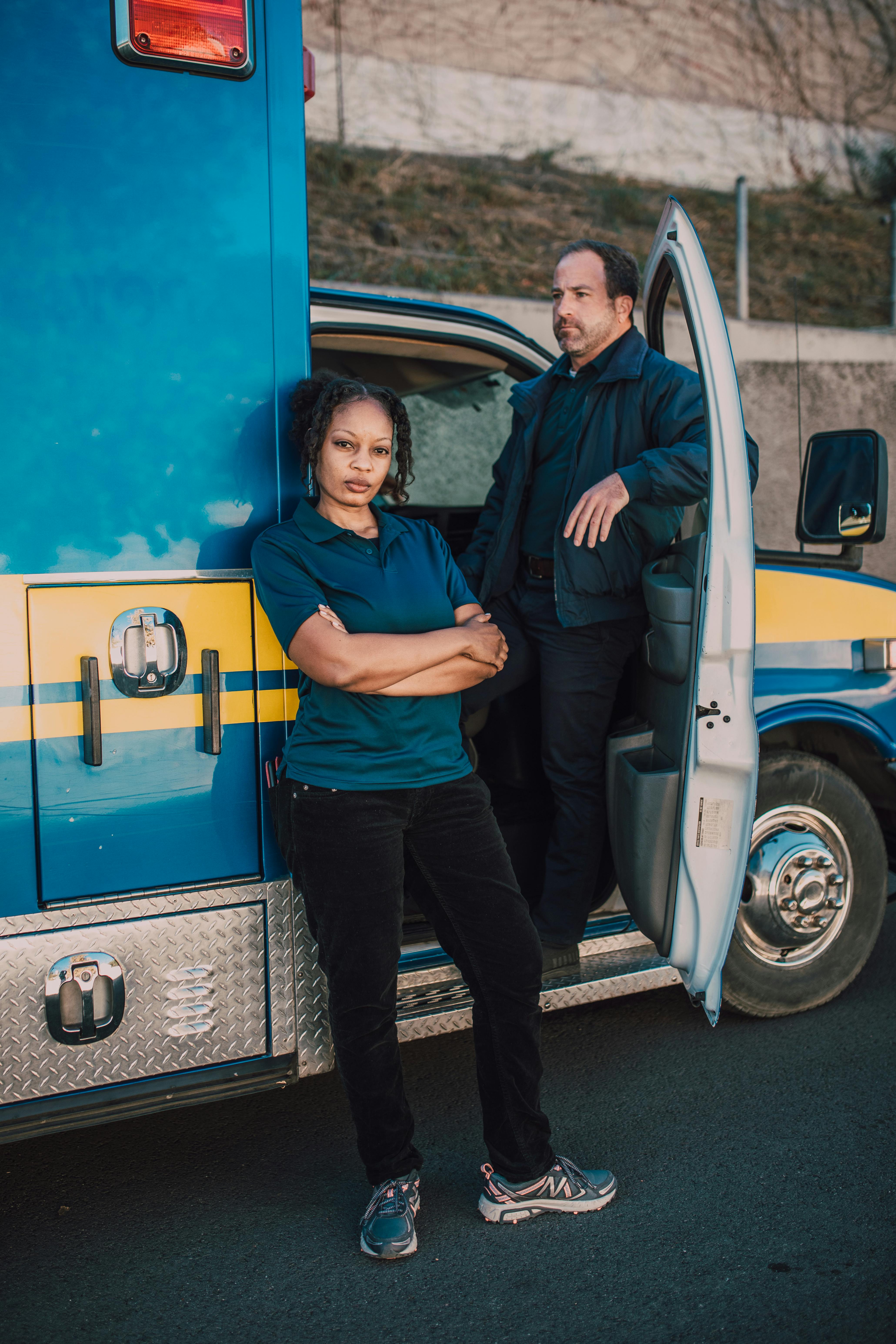 Paramedics at the Back of an Ambulance · Free Stock Photo