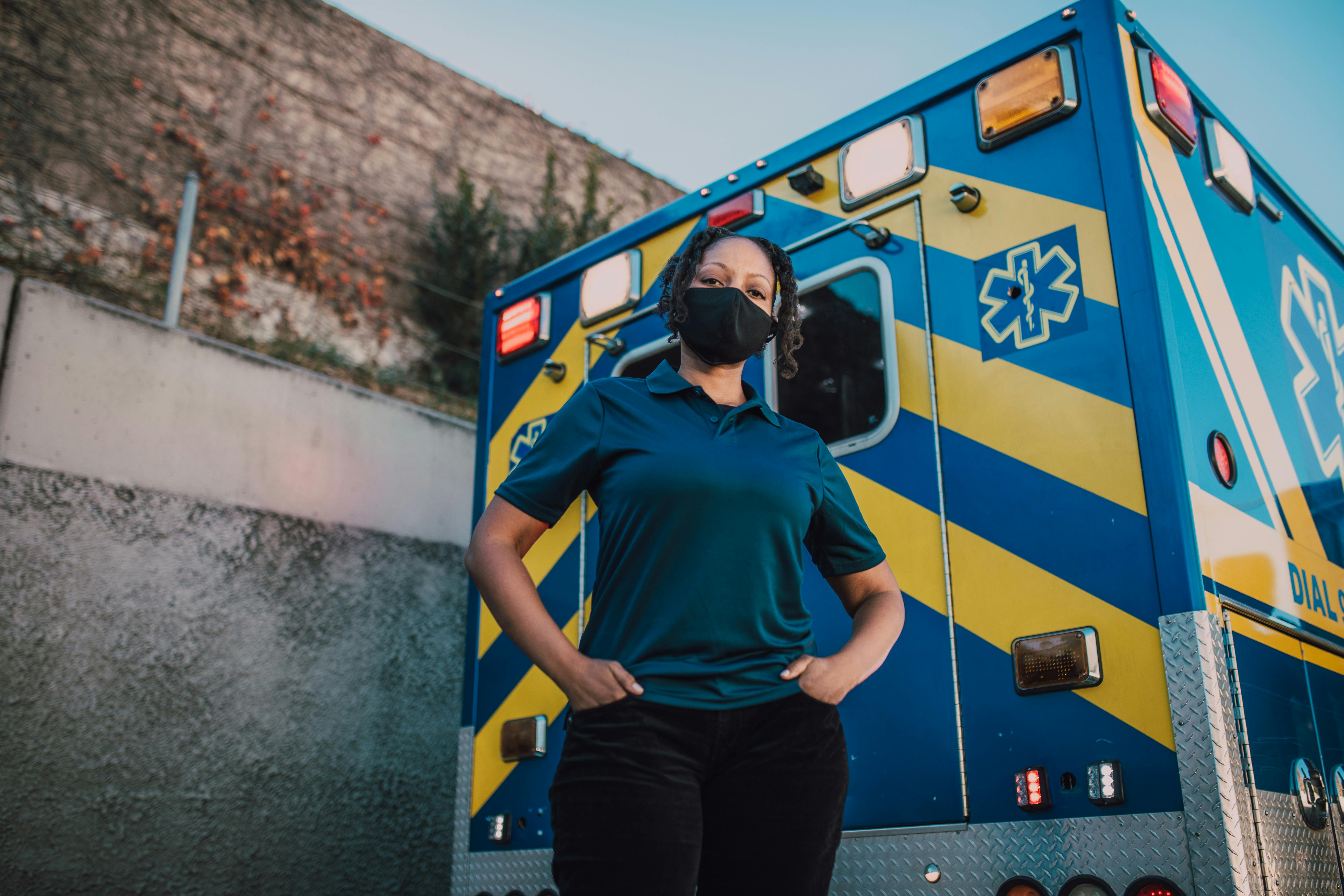 Paramedic Team Standing Behind an Ambulance · Free Stock Photo