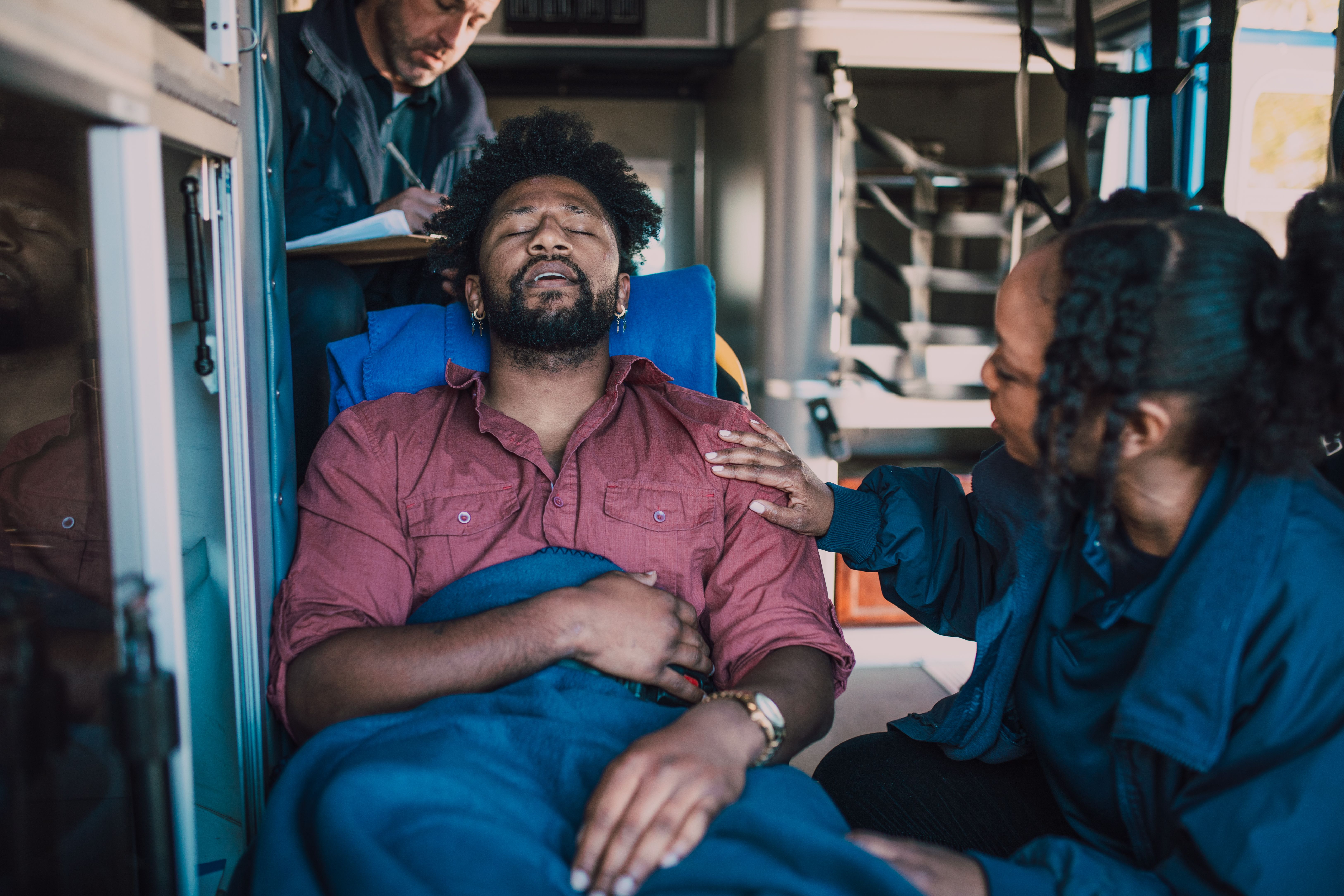 Paramedic Helping a Man · Free Stock Photo
