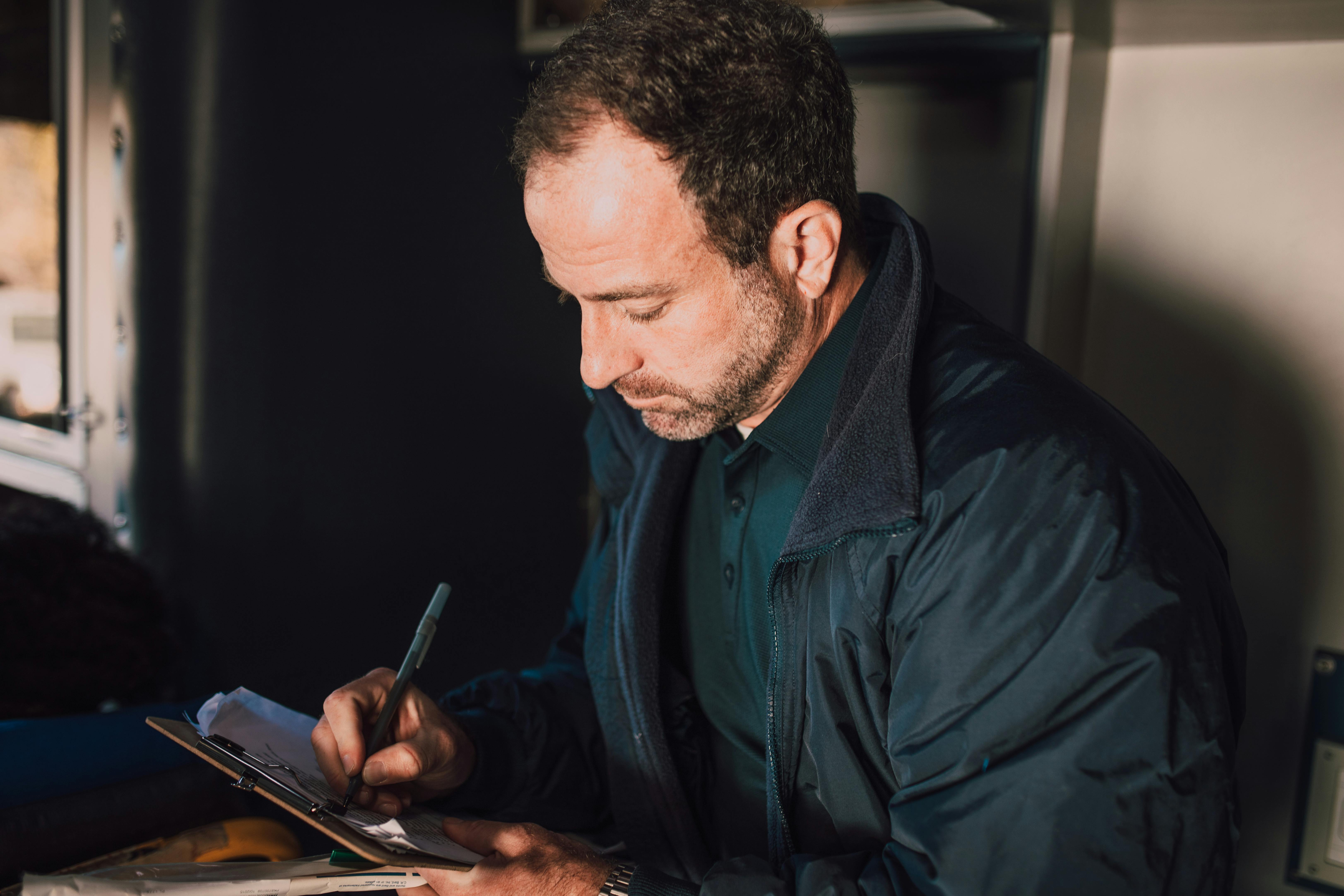 Paramedic Taking Notes · Free Stock Photo