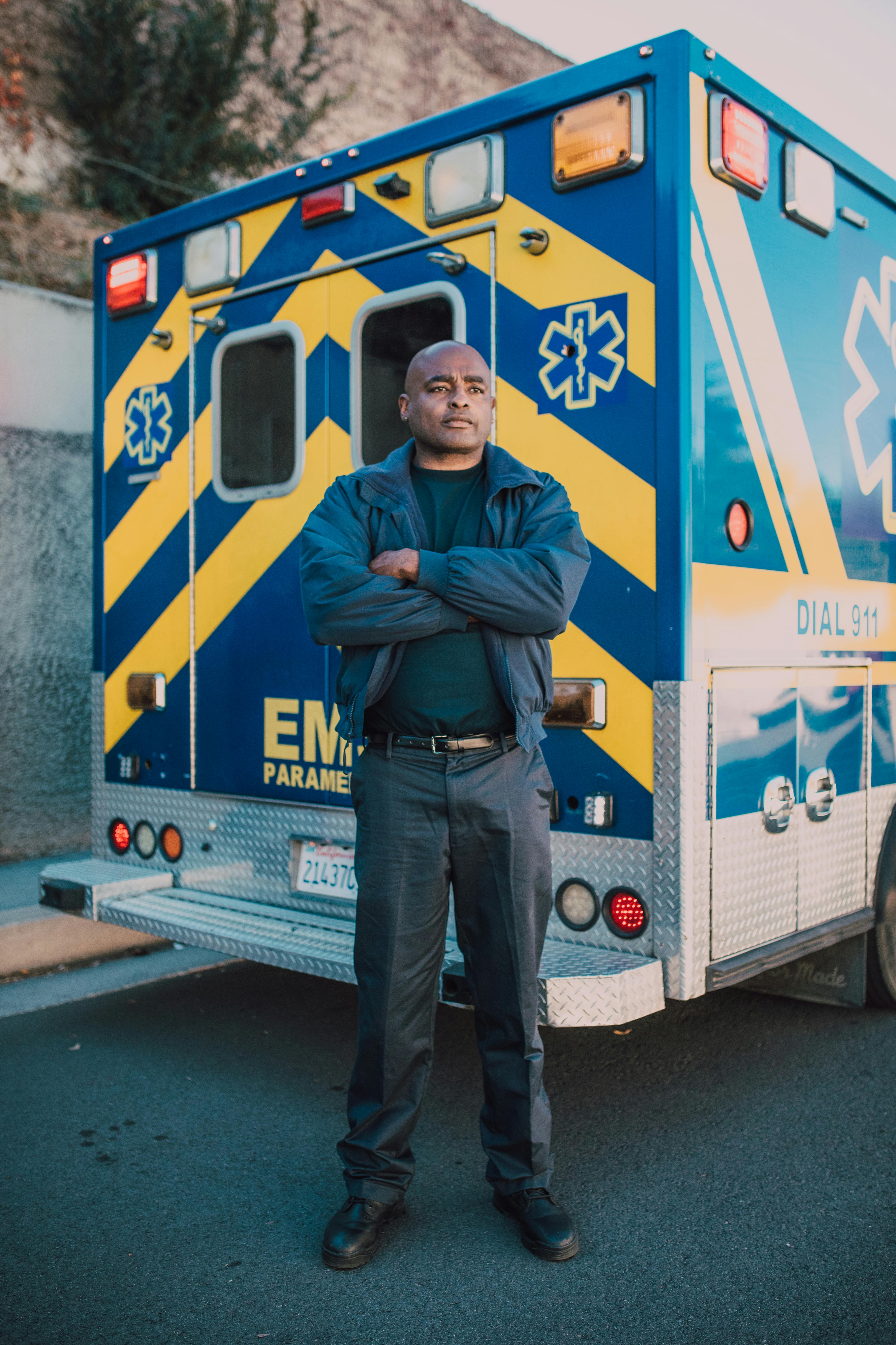 Man Standing By An Ambulance · Free Stock Photo