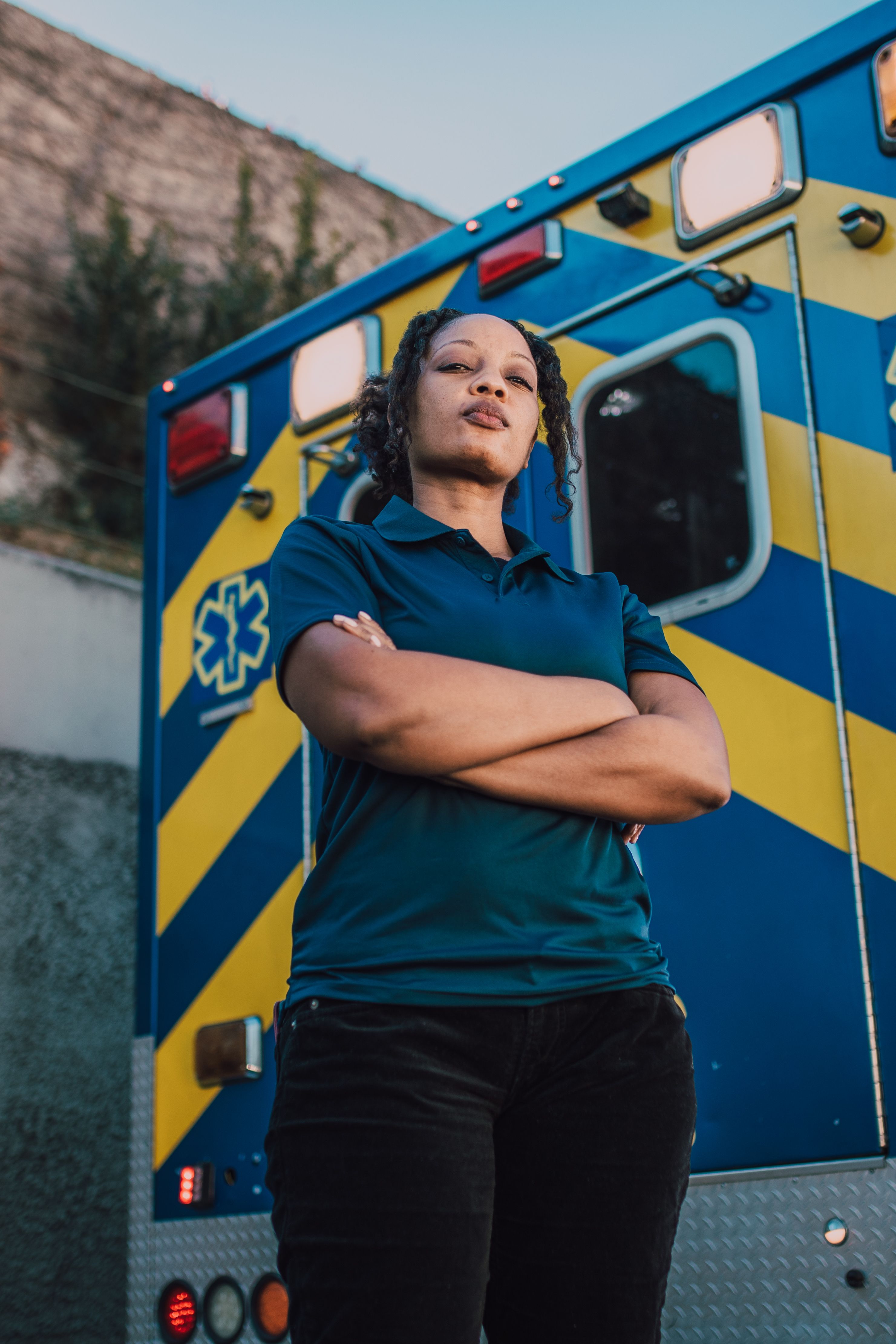Paramedic Standing Beside an Ambulance · Free Stock Photo