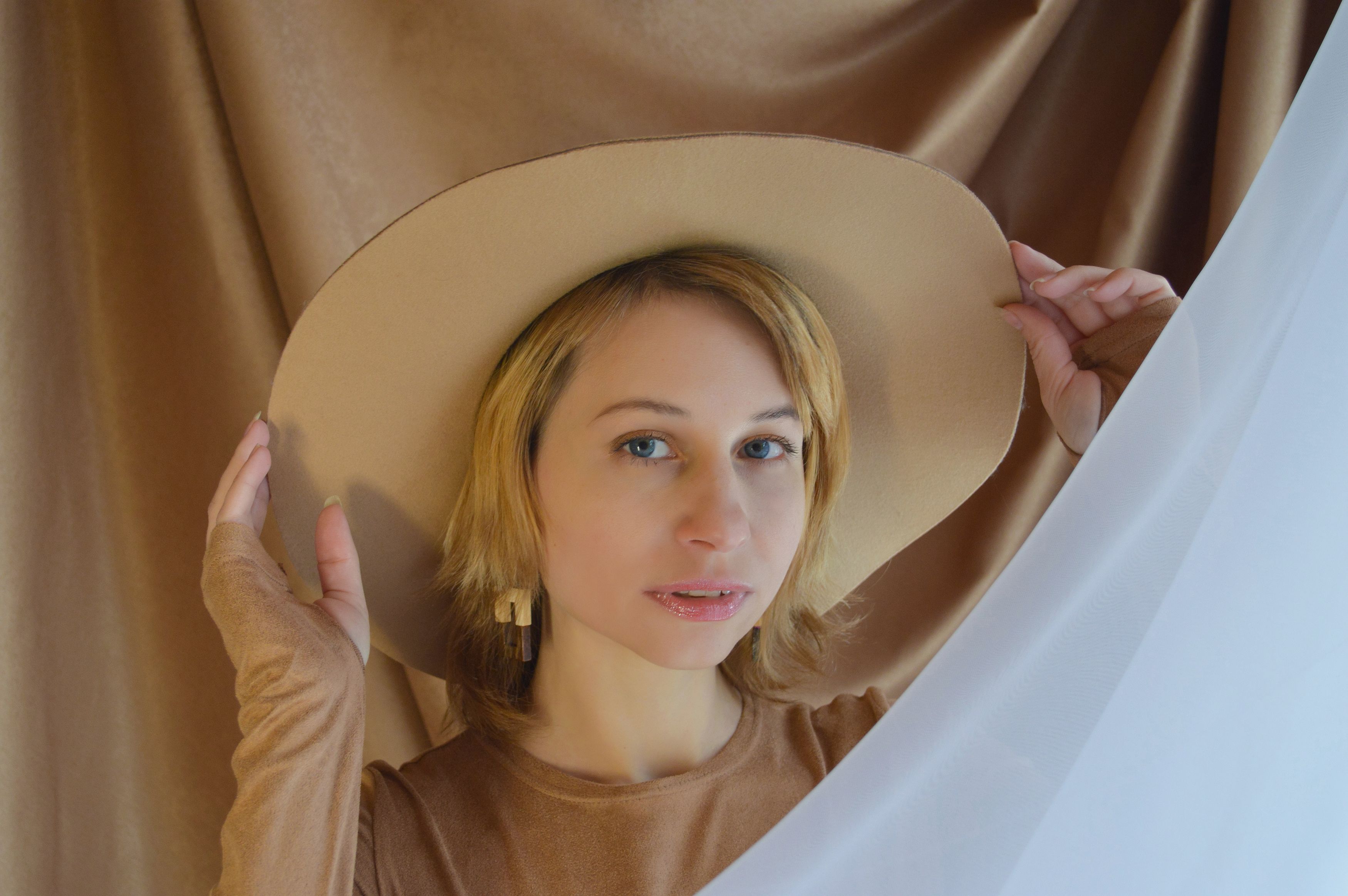 Close-Up Shot of Smiling Woman Wearing a Sun Hat · Free Stock Photo