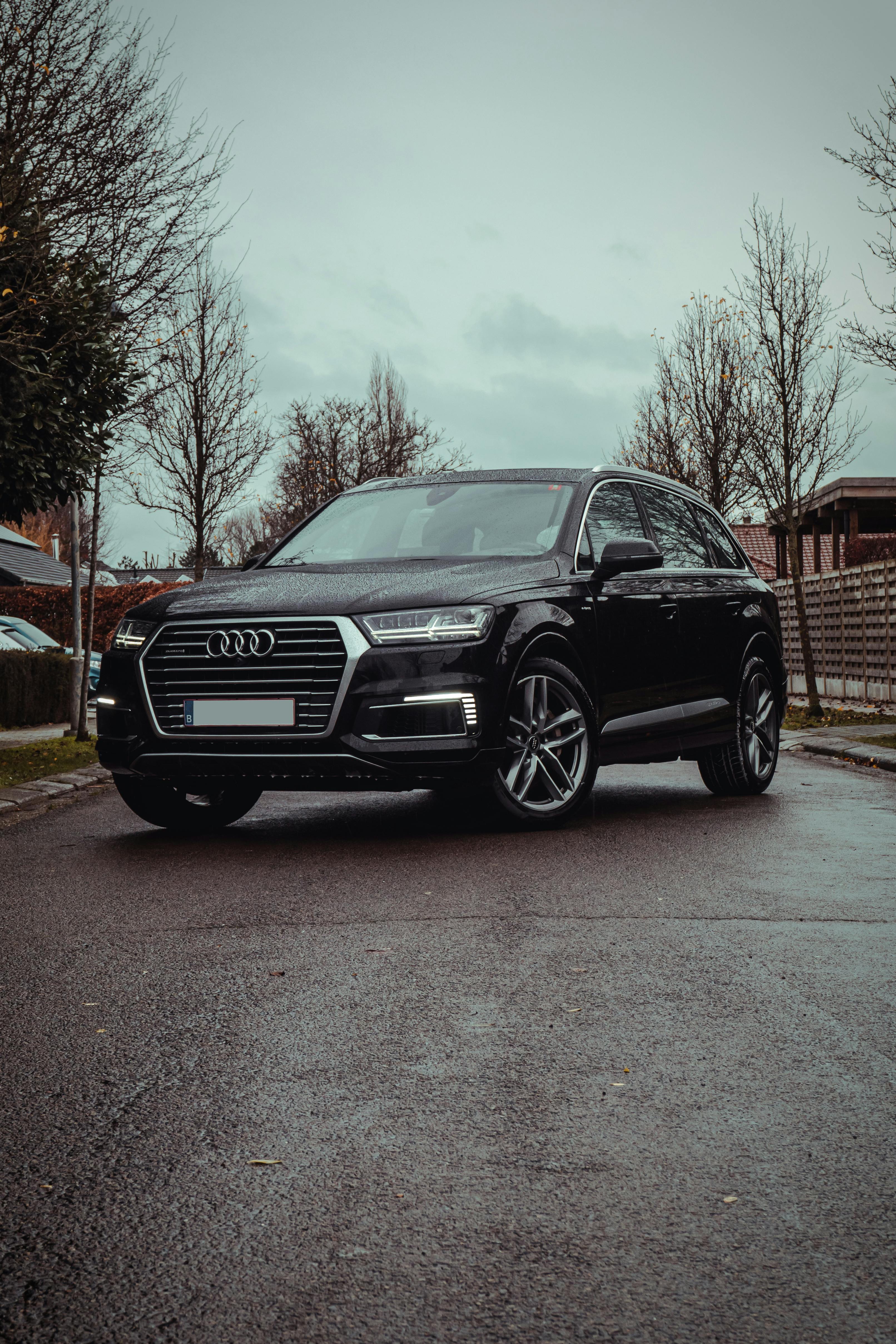 Black Audi Parked on Gray Concrete Pavement · Free Stock Photo