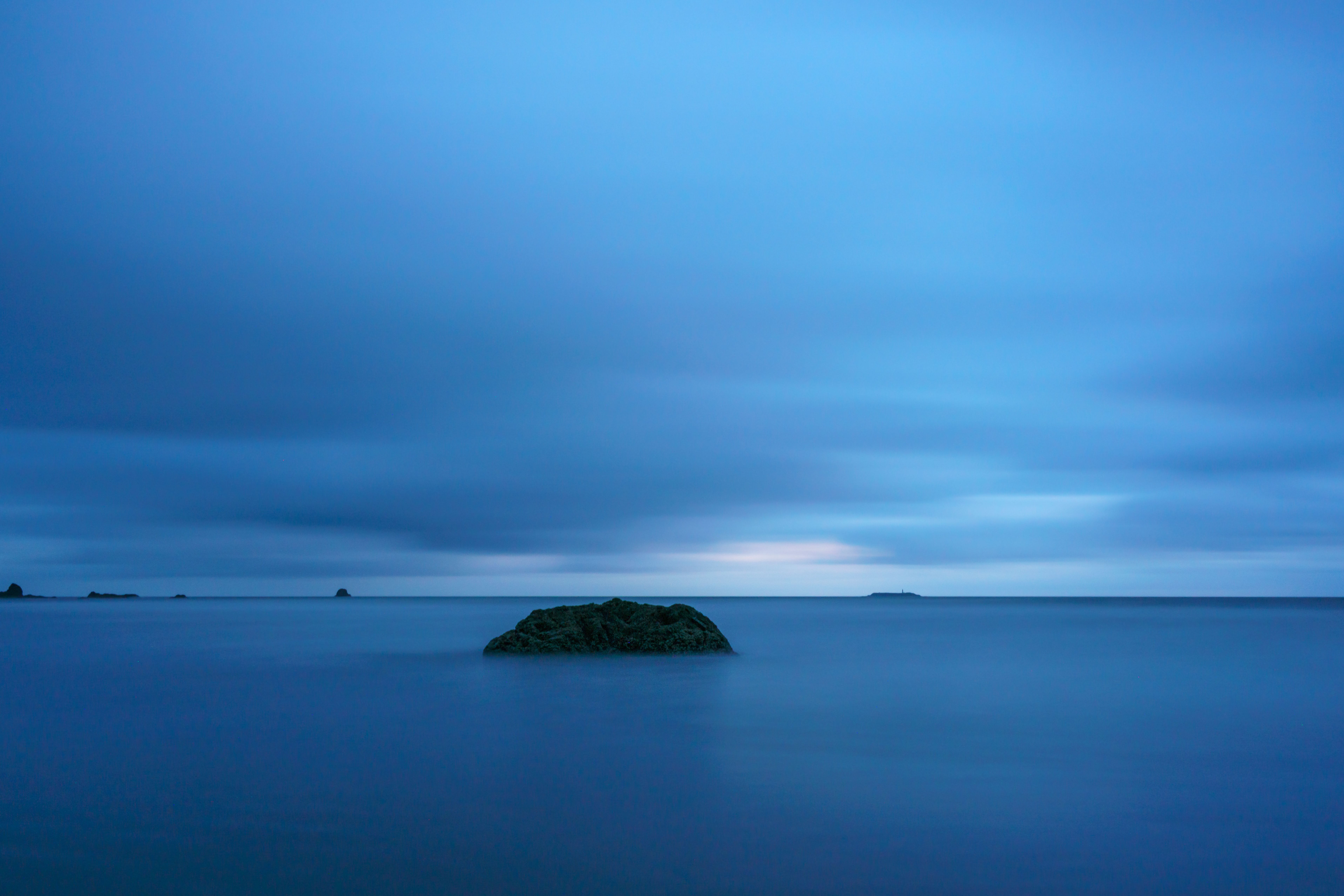 Dark Water Seascape Under Gray Sky · Free Stock Photo