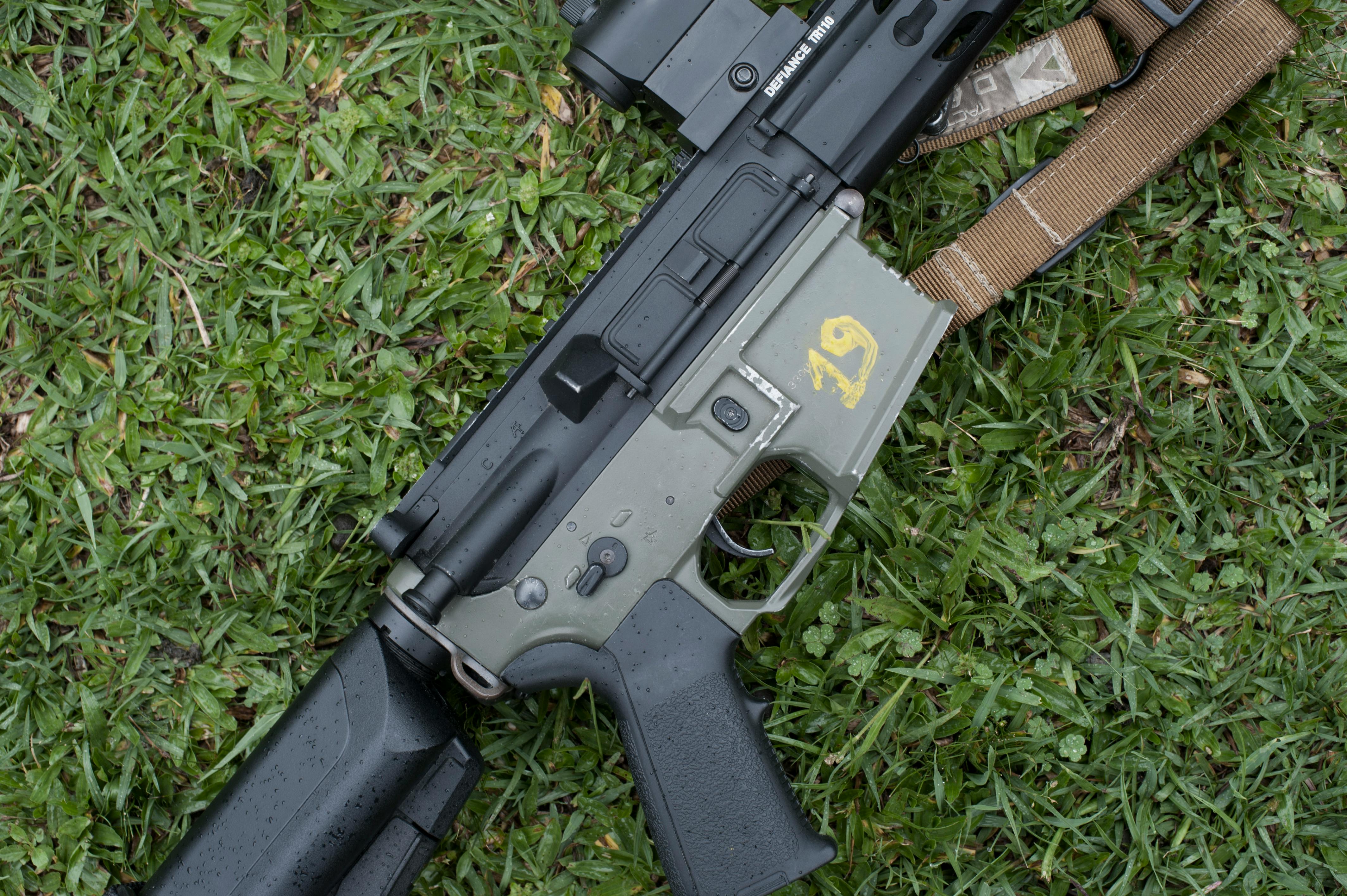 A Rifle on the Grass · Free Stock Photo