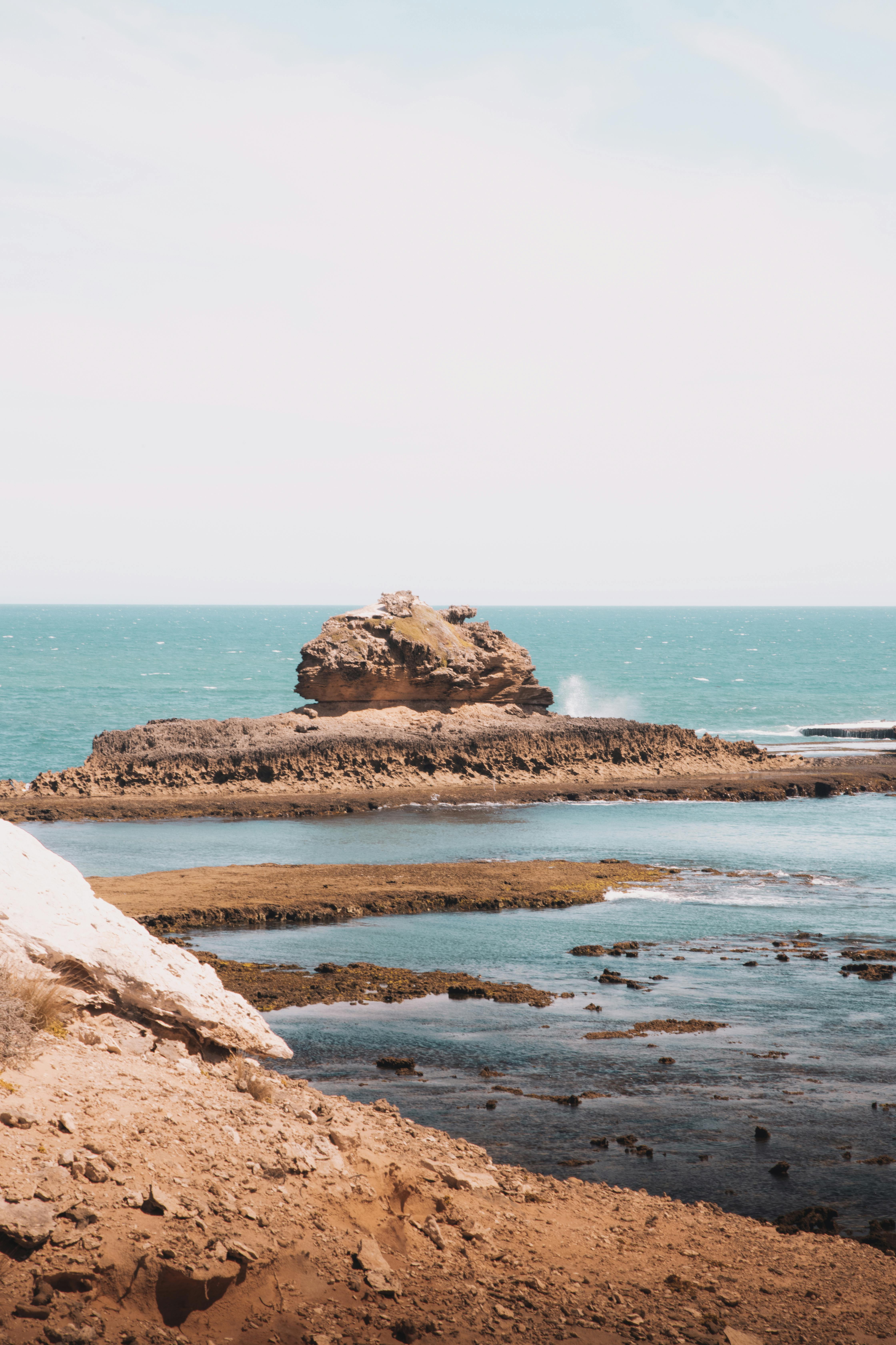Brown Rock Formation on Beach · Free Stock Photo