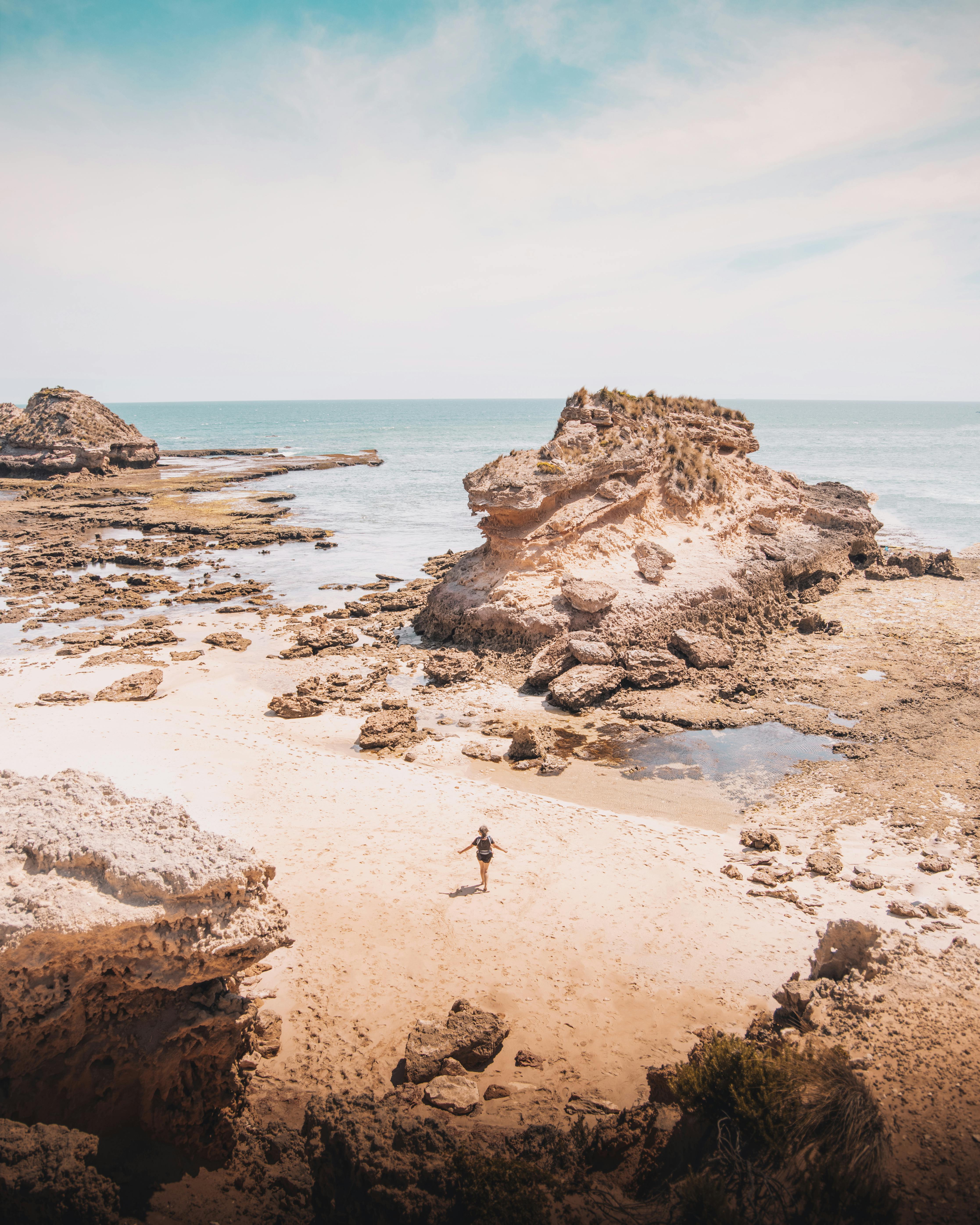 Brown Rock Formation on Beach · Free Stock Photo