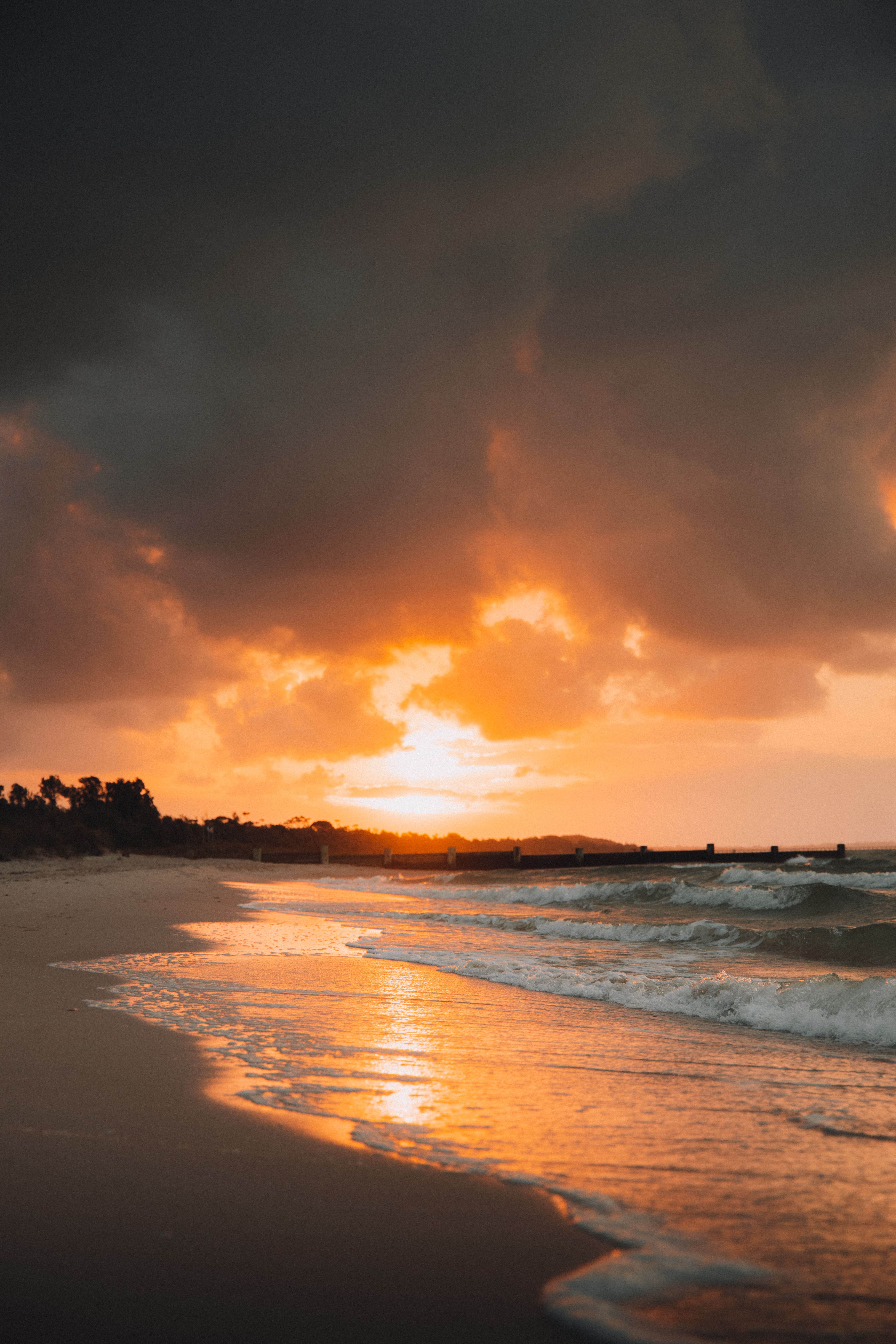 A Beach During Sunset · Free Stock Photo