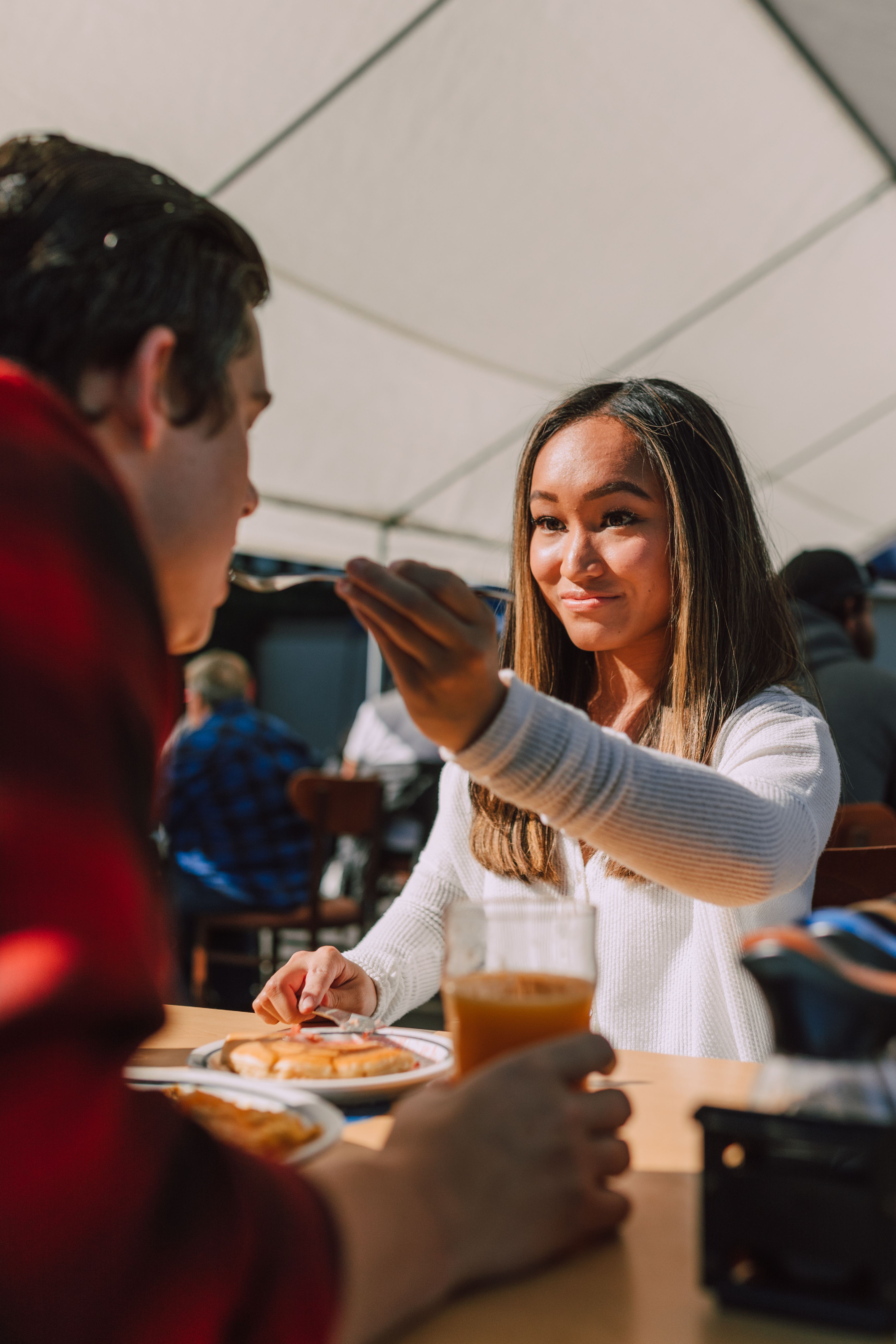 A Woman Feeding a Man · Free Stock Photo