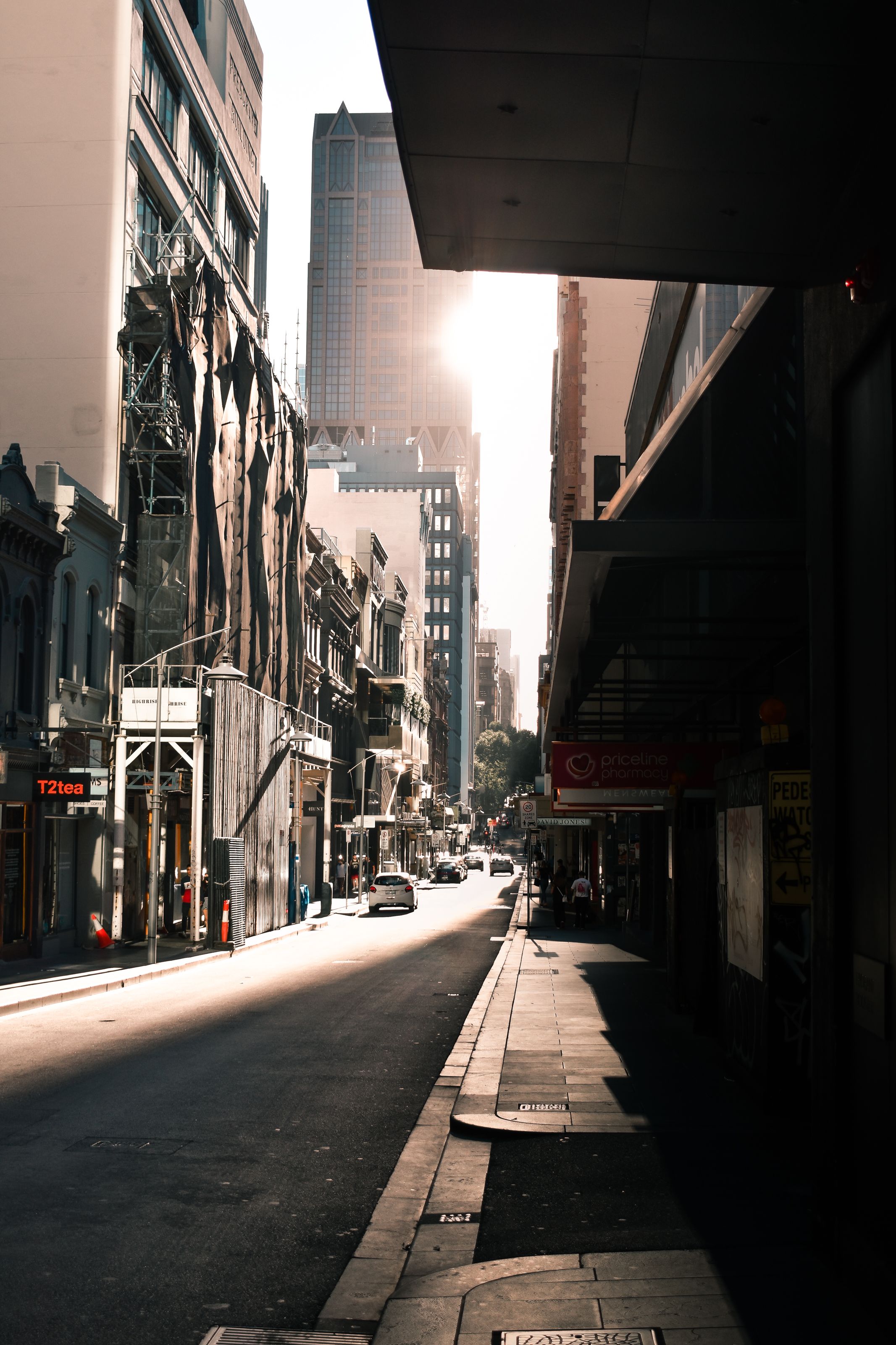 A Road Between Concrete Buildings · Free Stock Photo
