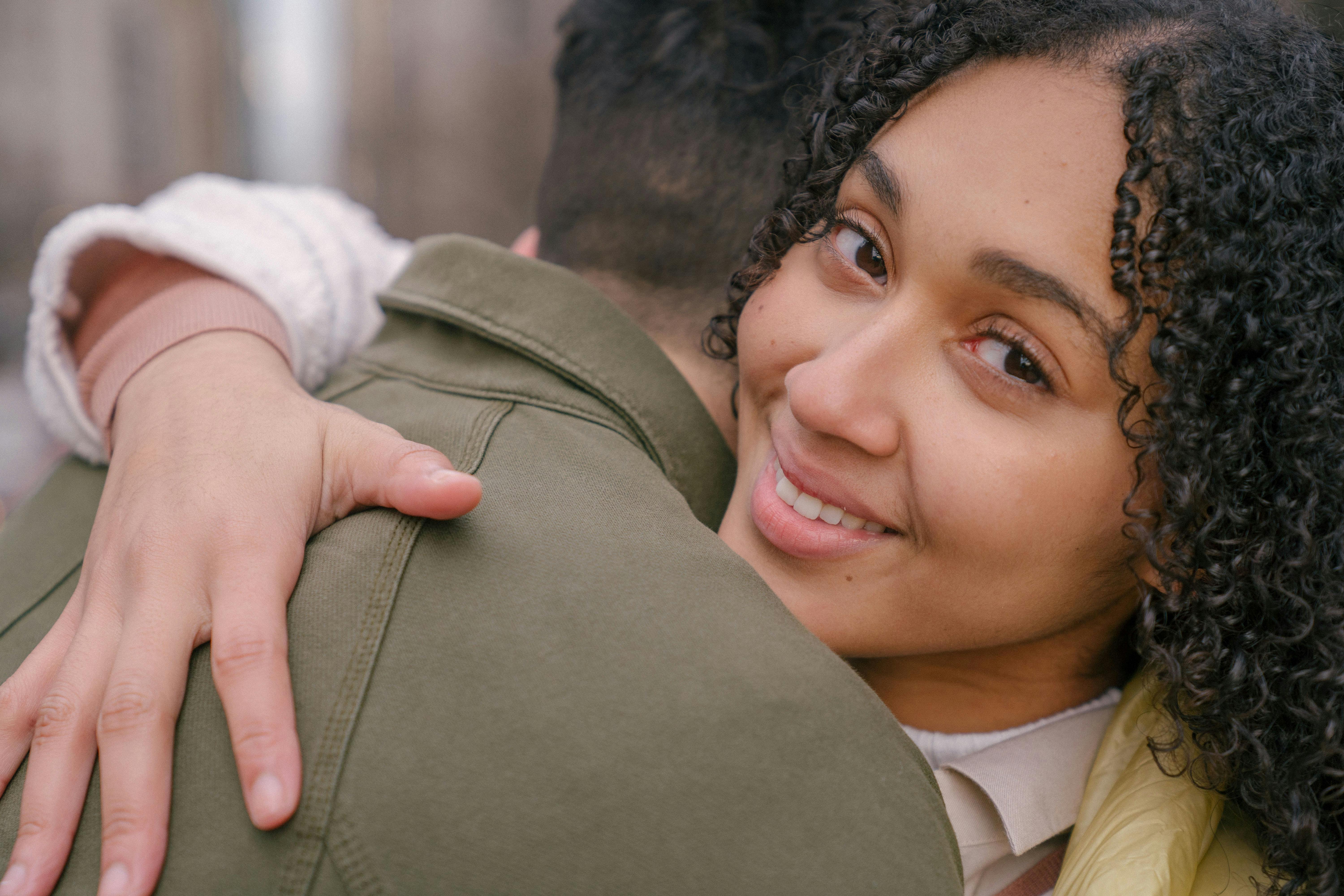 Happy Hispanic woman embracing boyfriend · Free Stock Photo