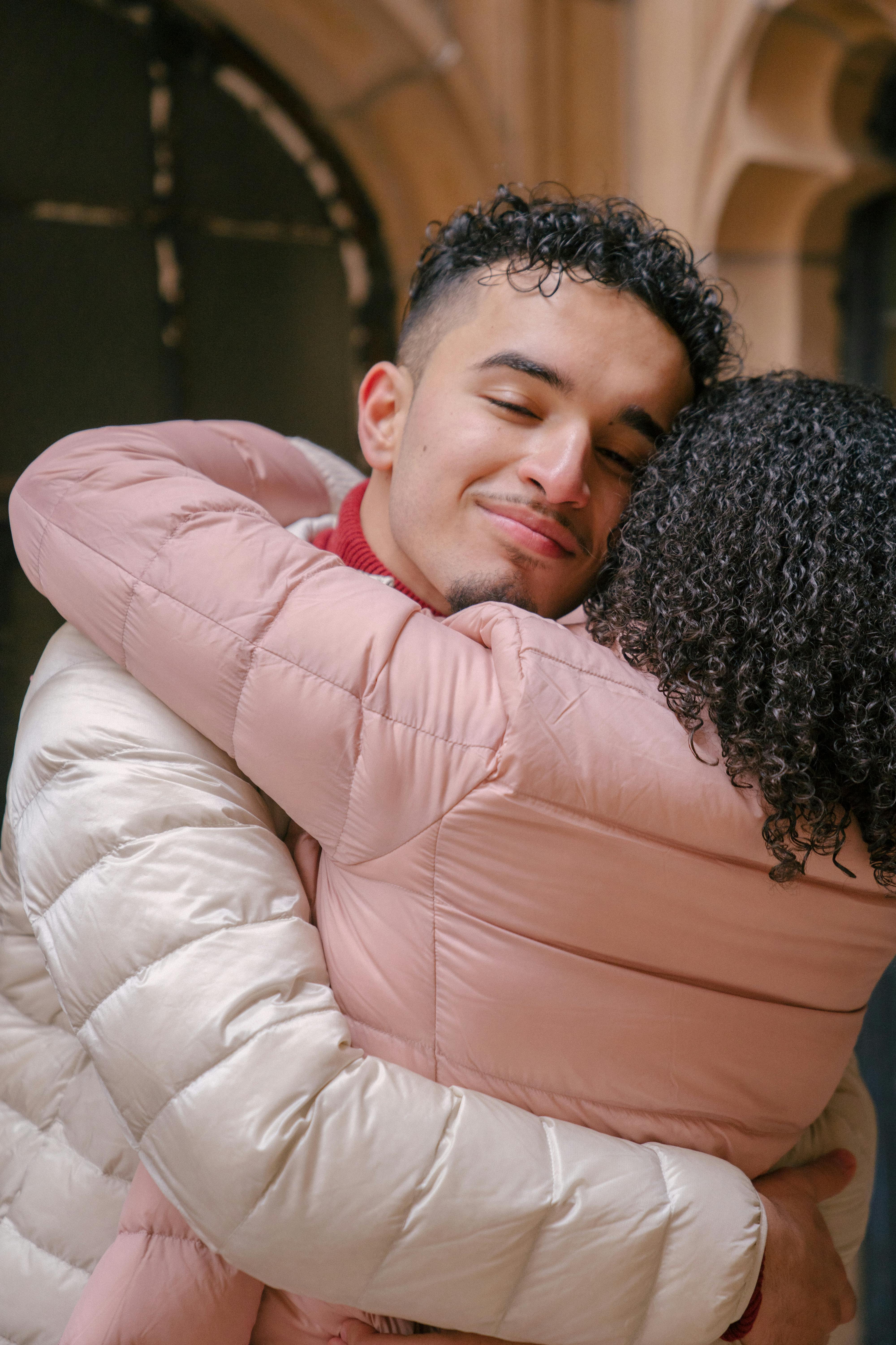 Loving romantic ethnic couple embracing gently · Free Stock Photo