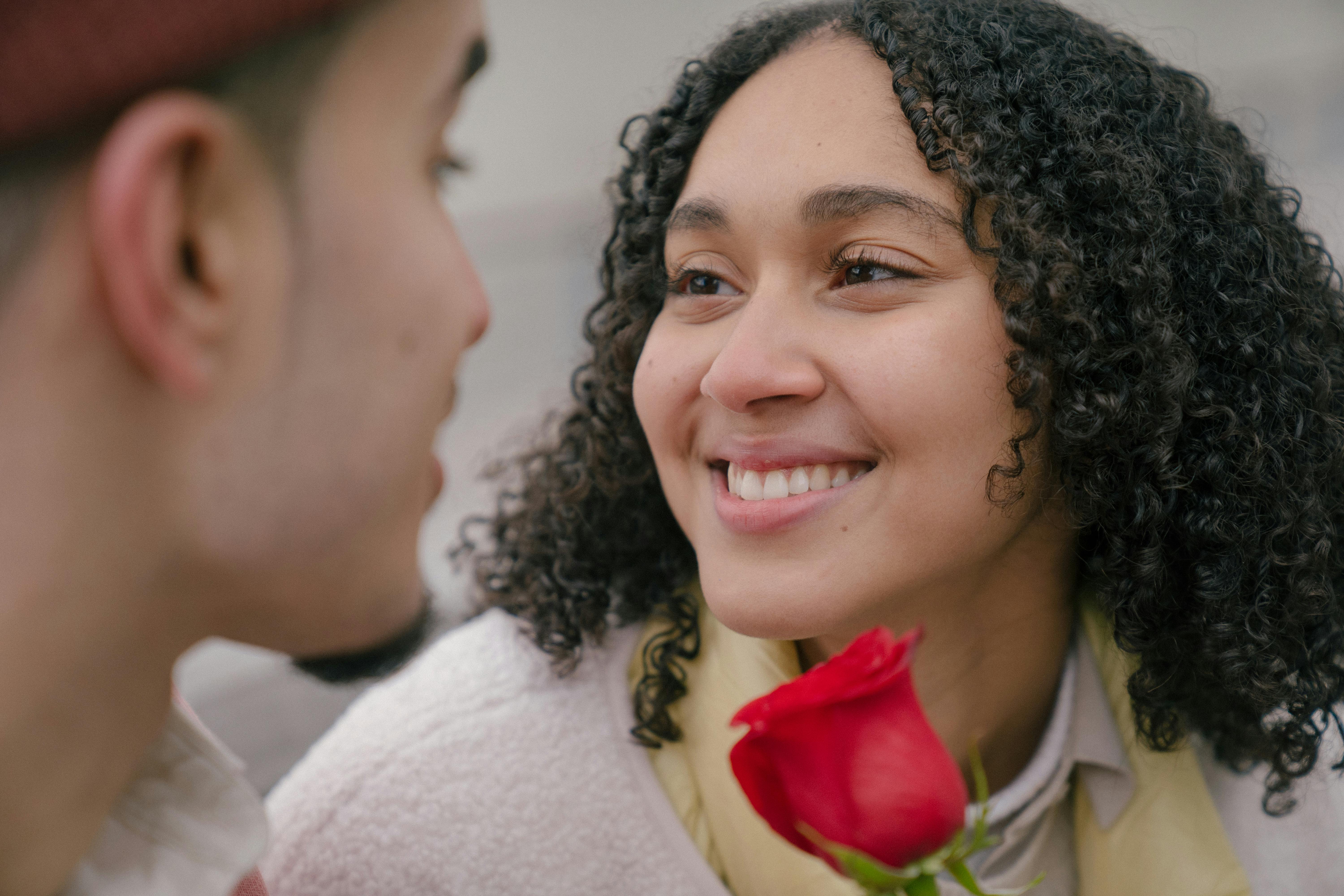 Hispanic couple with red rose · Free Stock Photo