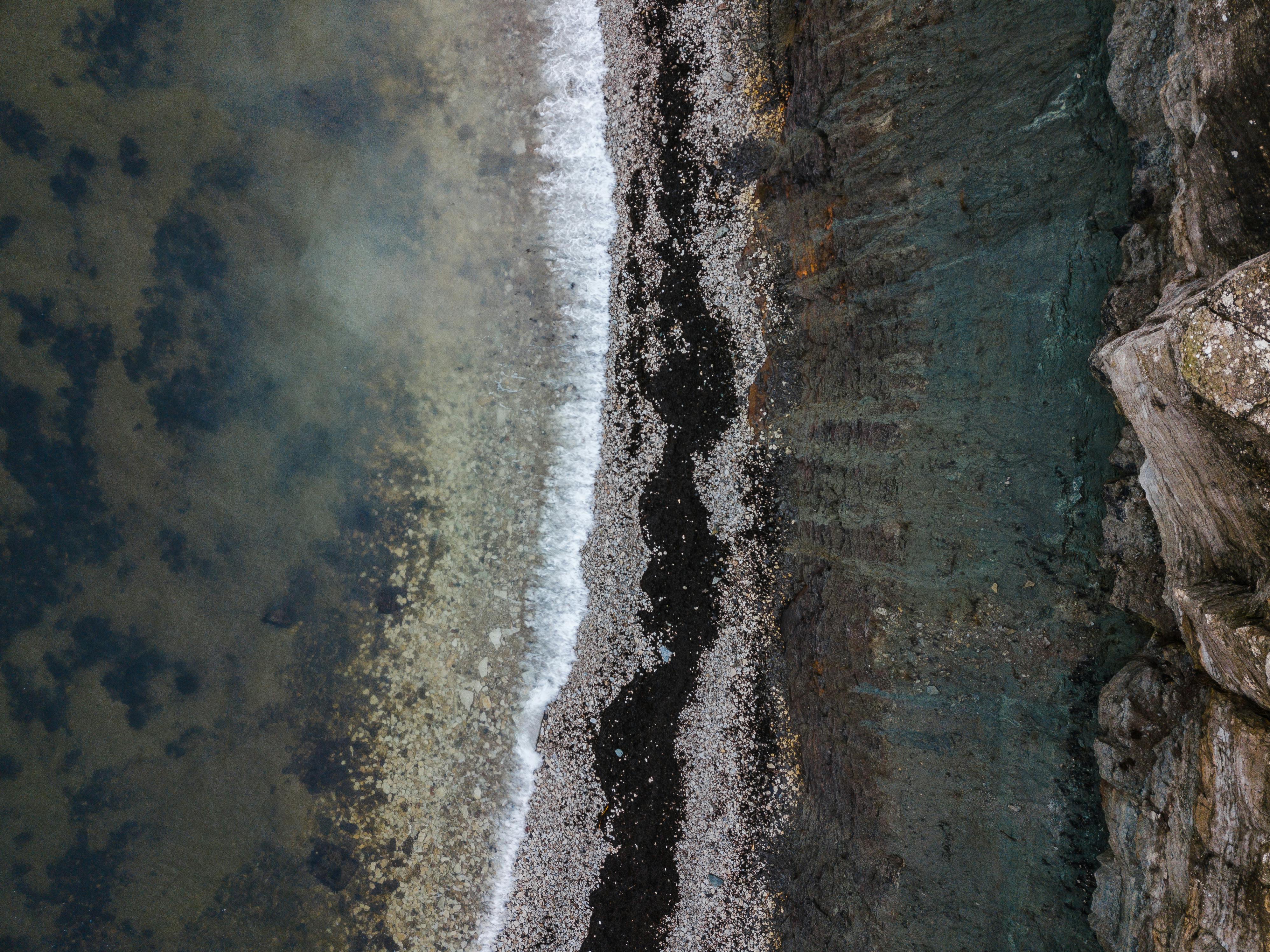 Top View Photo of Rocky Shore · Free Stock Photo