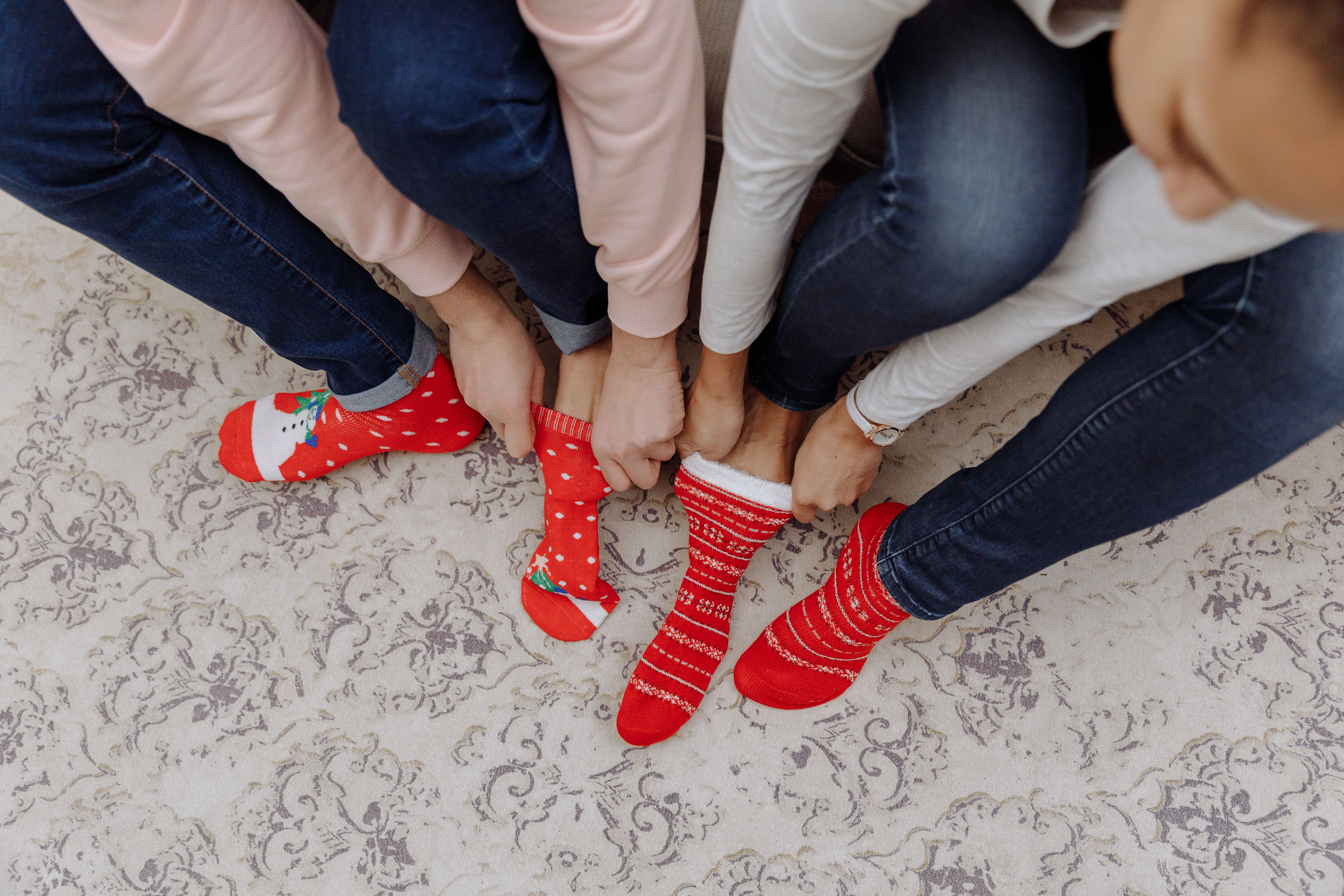 People Wearing Christmas Socks · Free Stock Photo