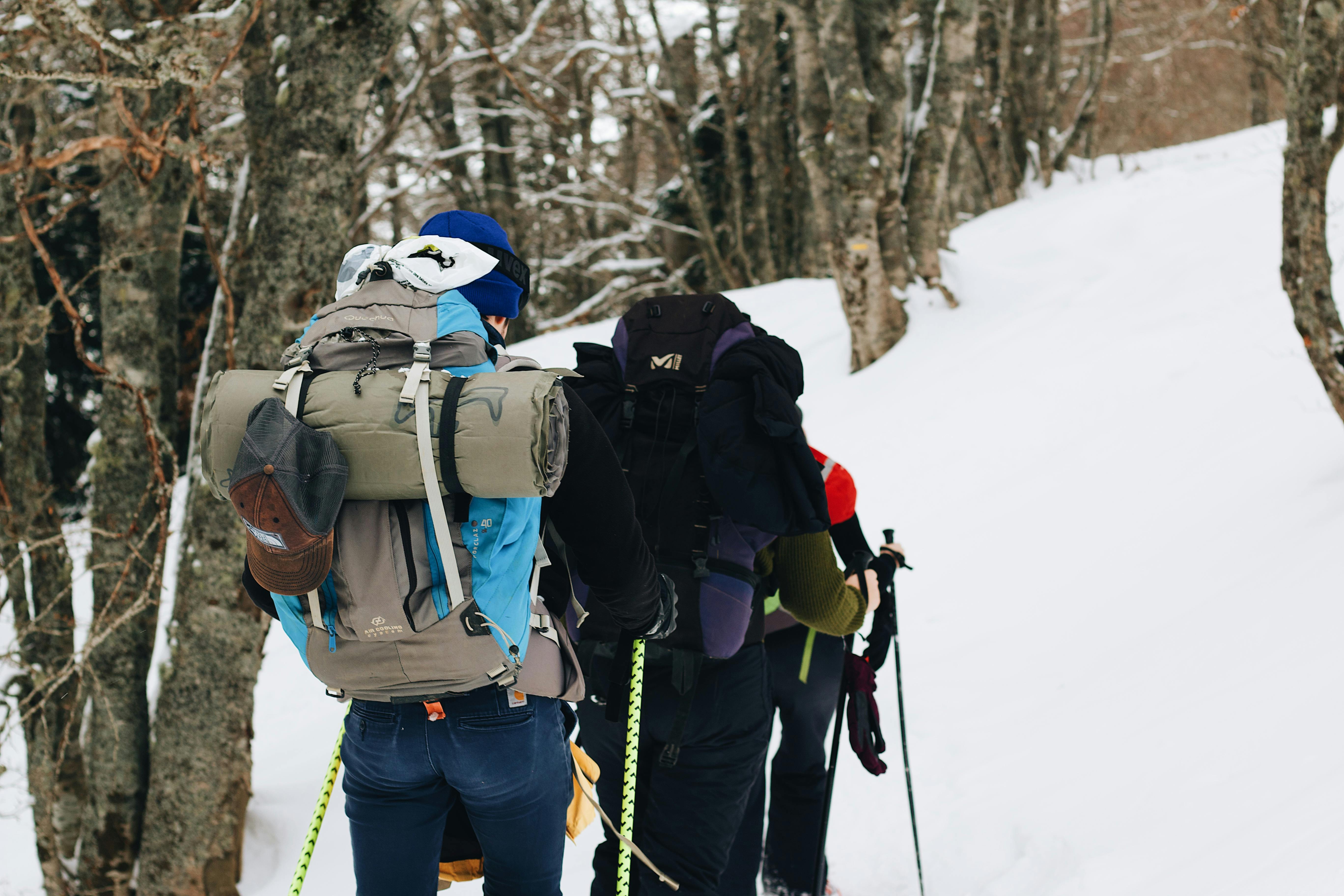 Two People Wearing Jacket And Red Backpack During Winter Season · Free ...
