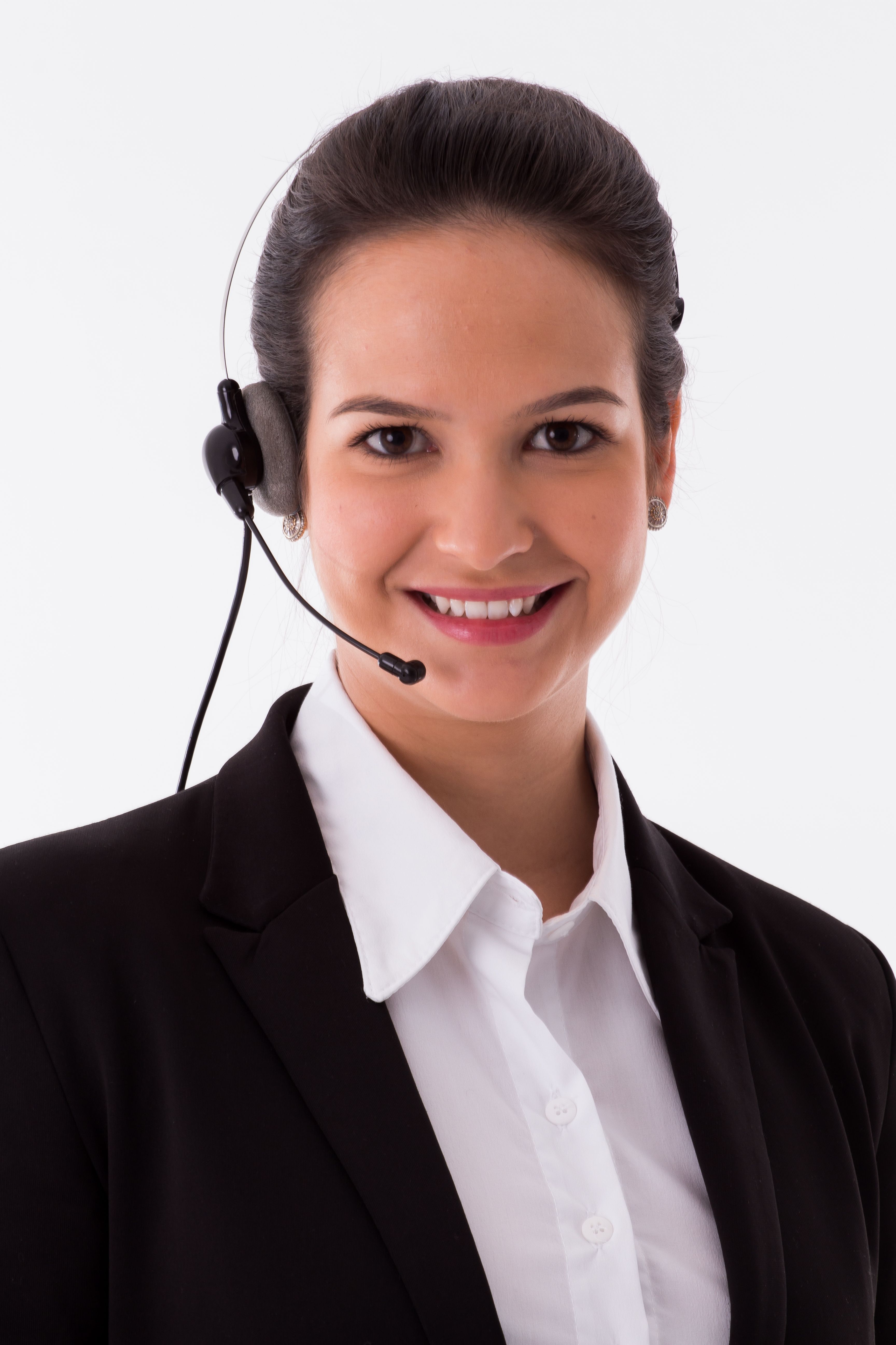 Hospitable Woman Standing Behind Front Desk · Free Stock Photo
