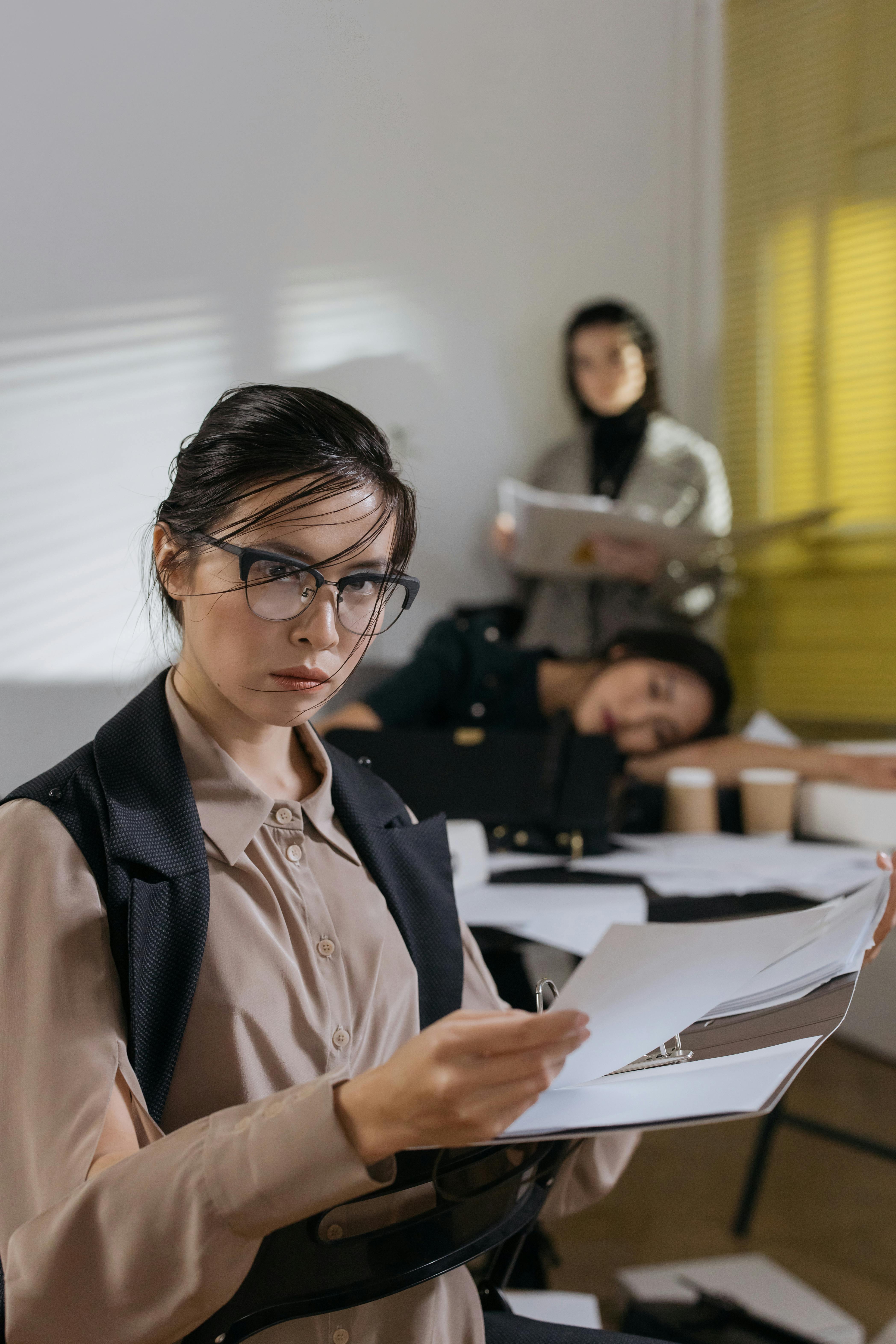 High-Angle Shot of Two People Holding Documents · Free Stock Photo
