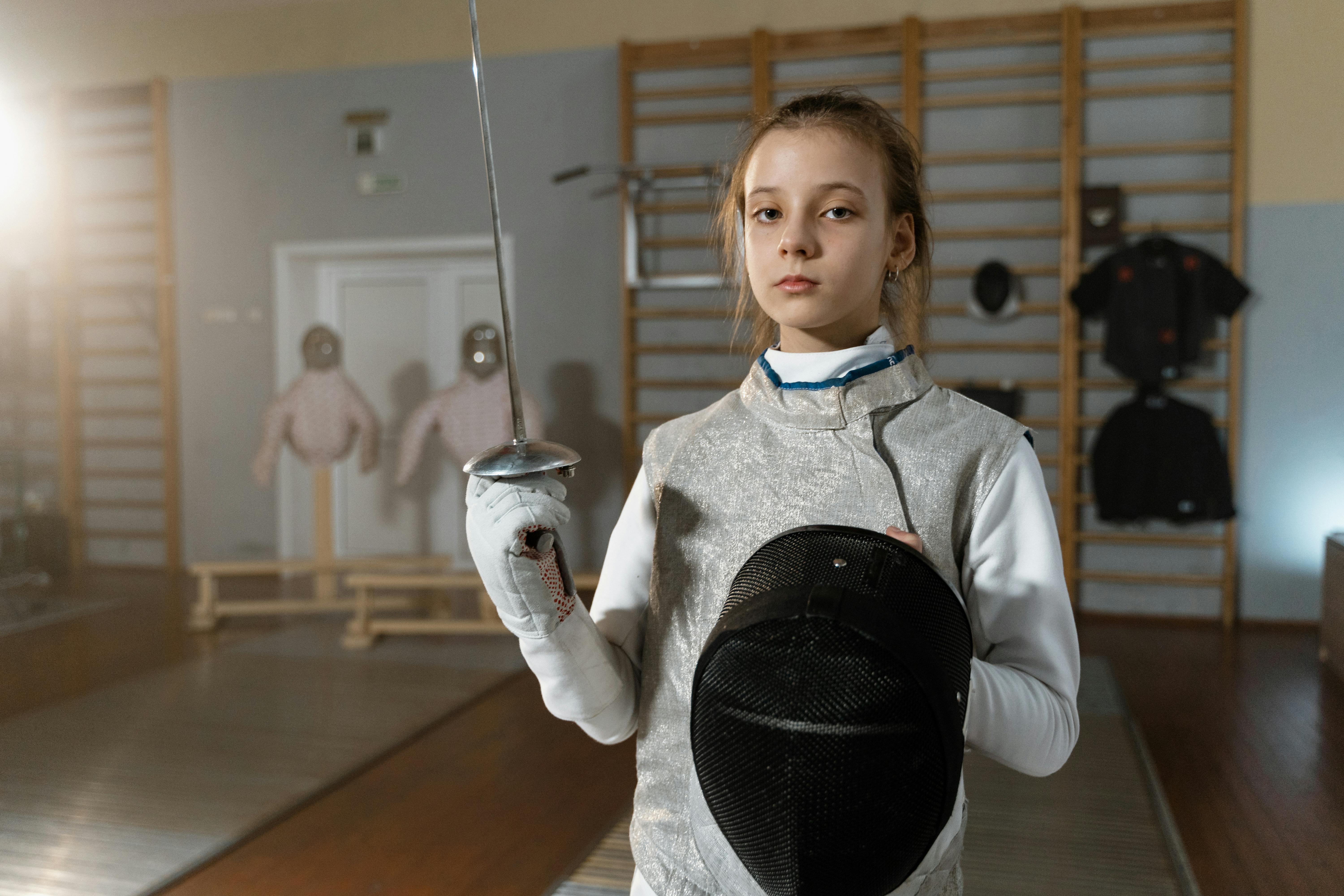A Young Fencer with Her Fencing Gears · Free Stock Photo
