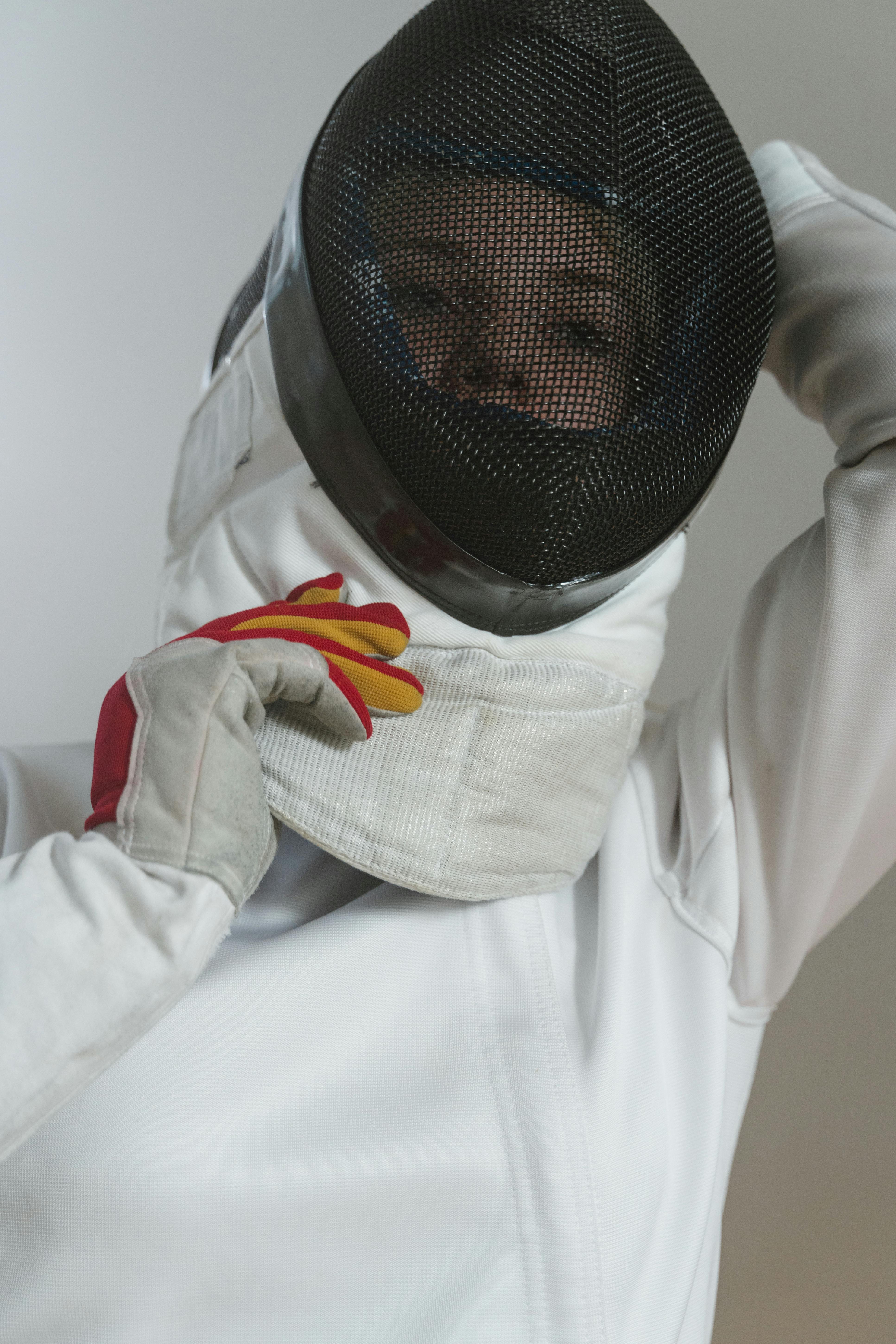 A Woman Wearing a Fencing Mask · Free Stock Photo
