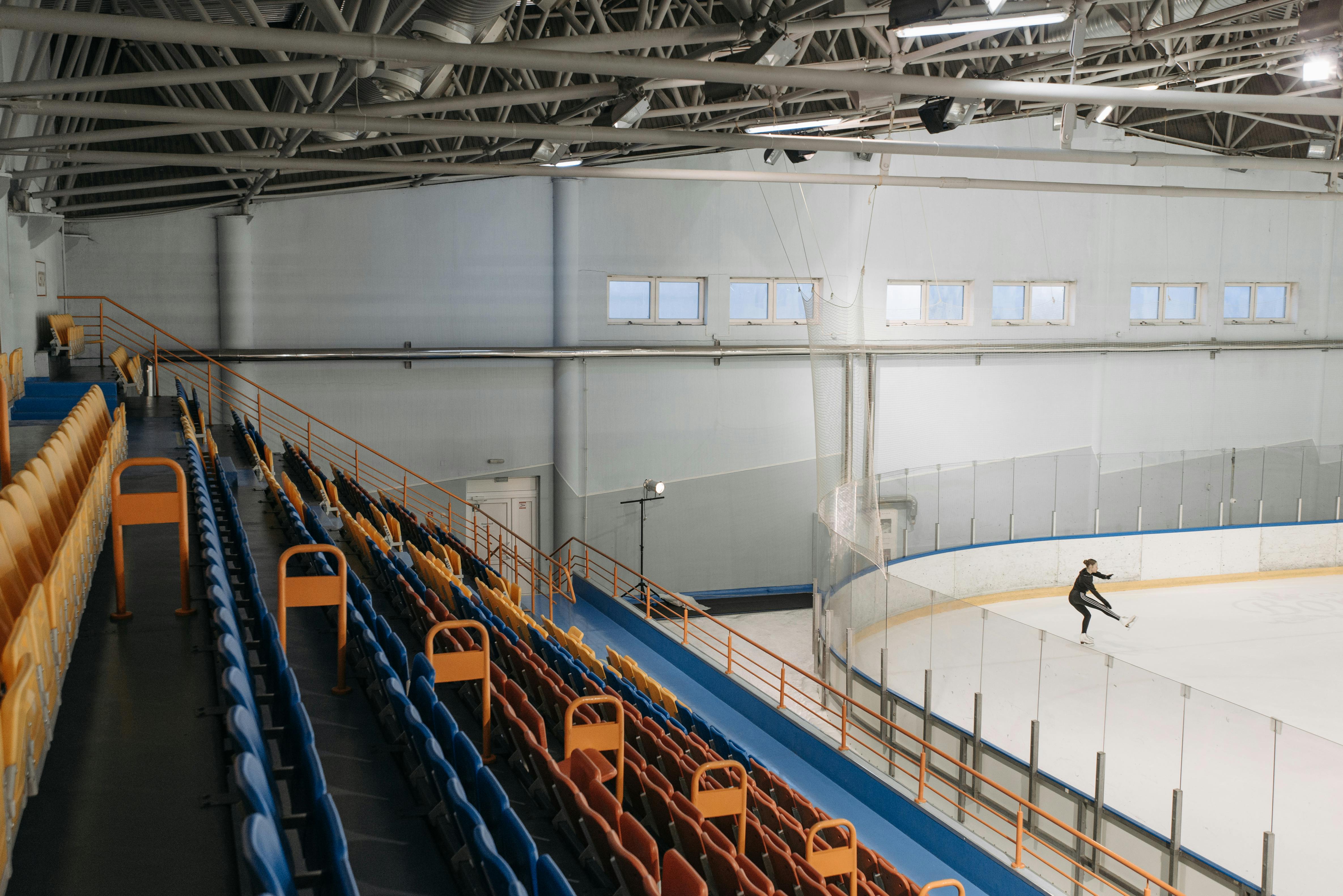 A Person Ice Skating at the Ice Rink · Free Stock Photo