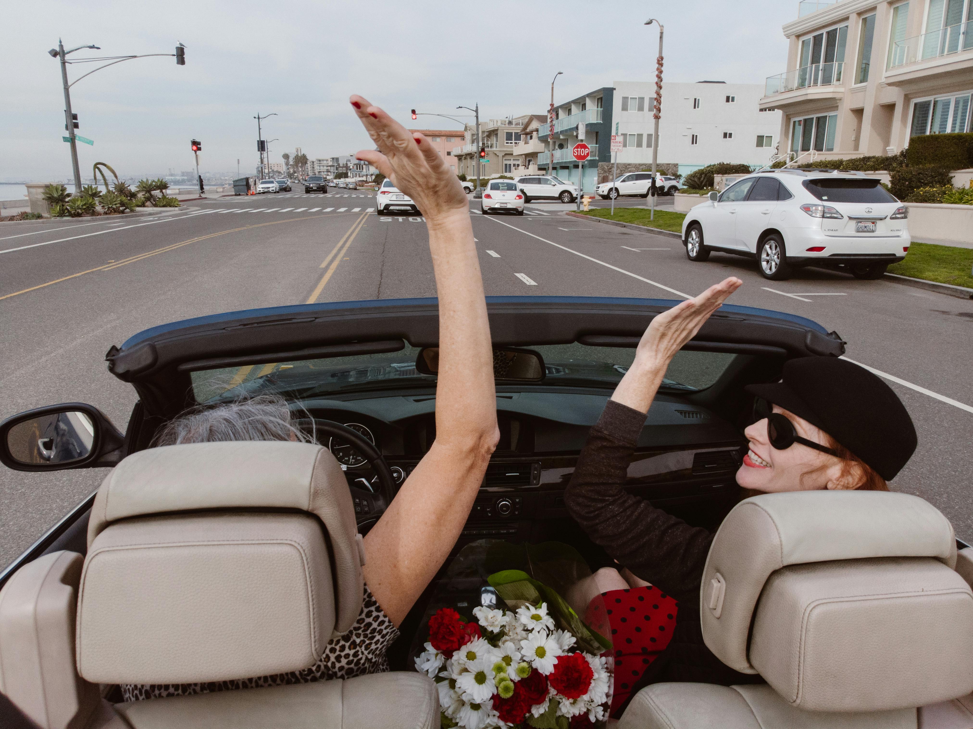 Two People Riding in Convertible Car · Free Stock Photo