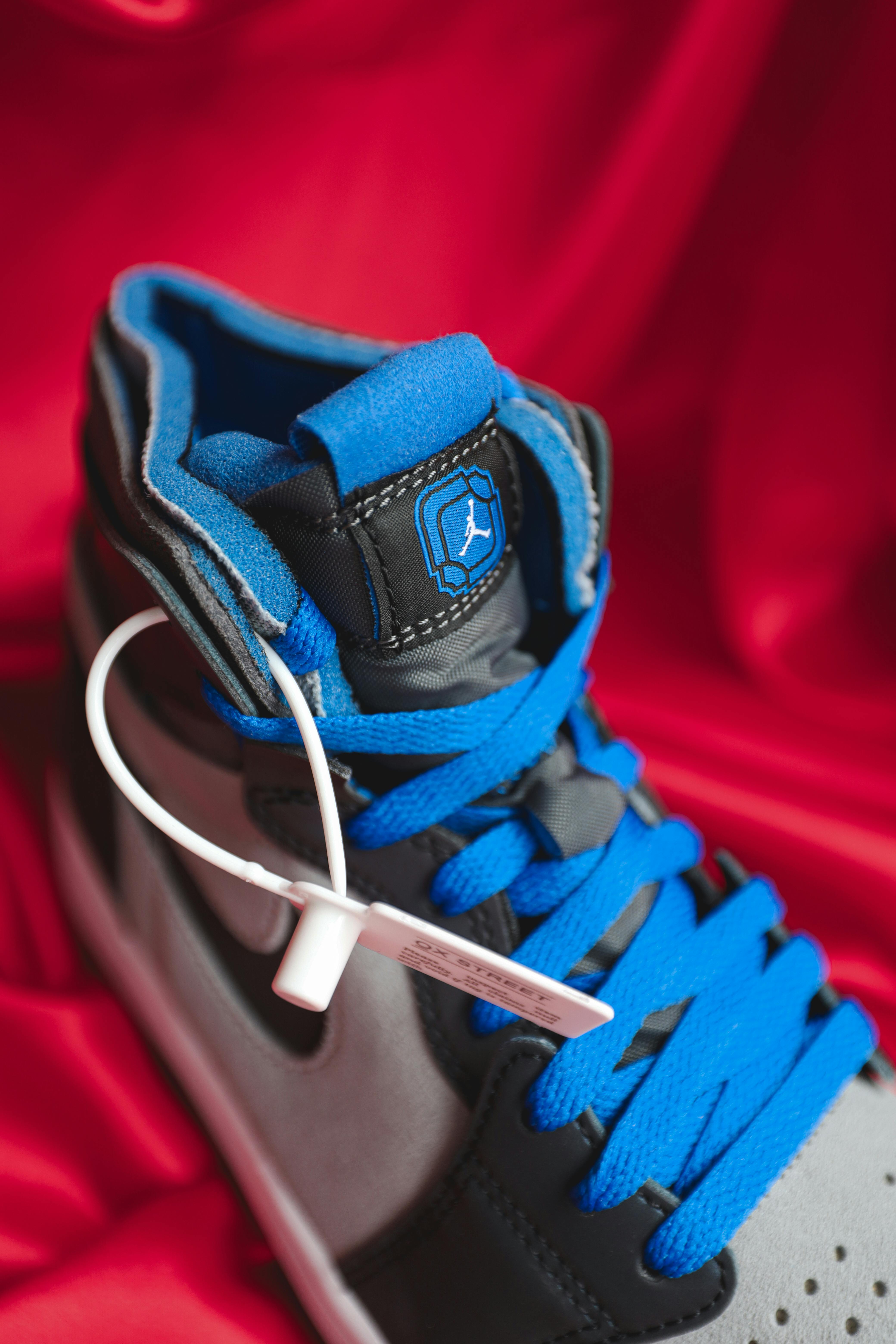 Branded Sneakers on Shelves · Free Stock Photo