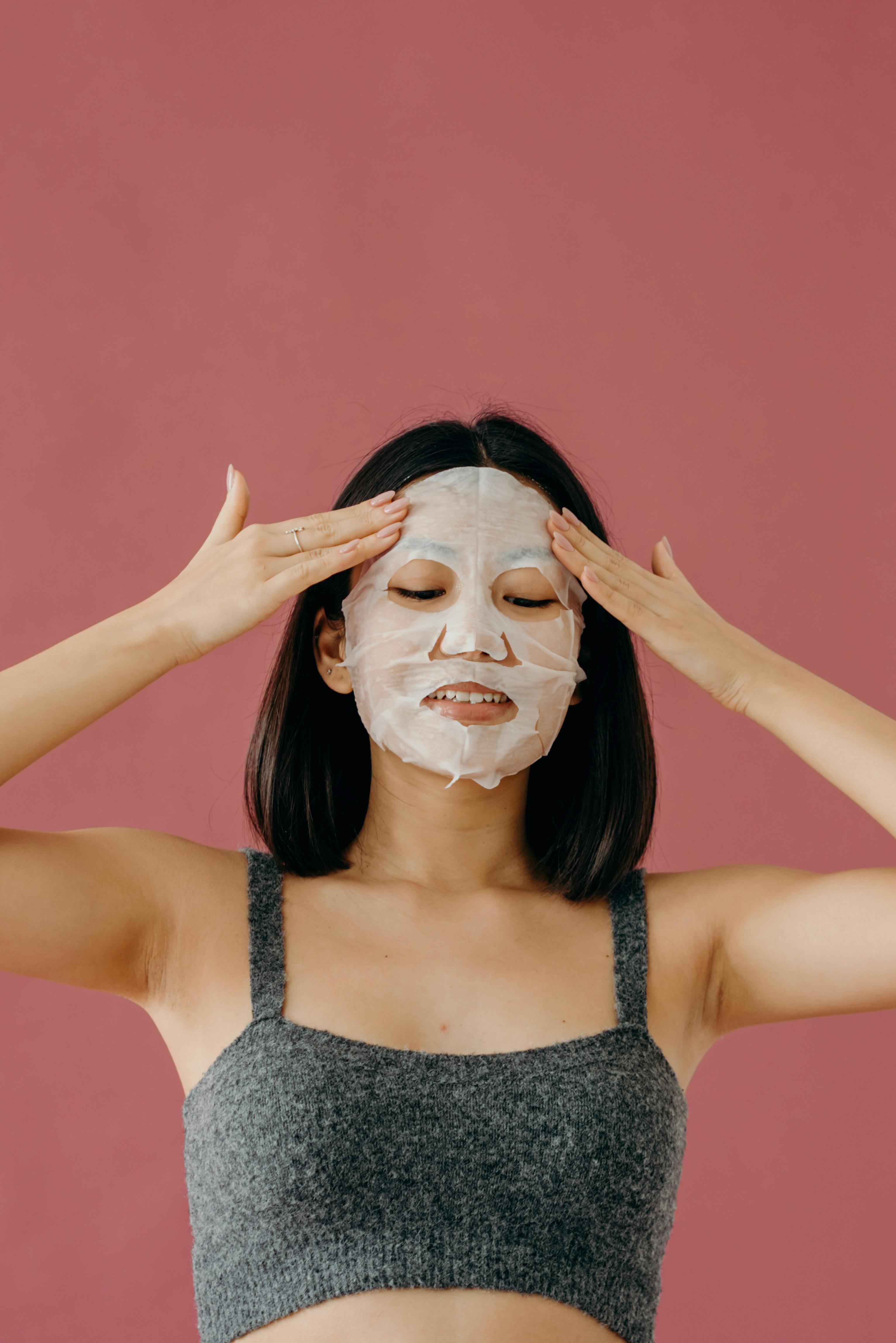 A Woman Touching Her Face with Mask · Free Stock Photo