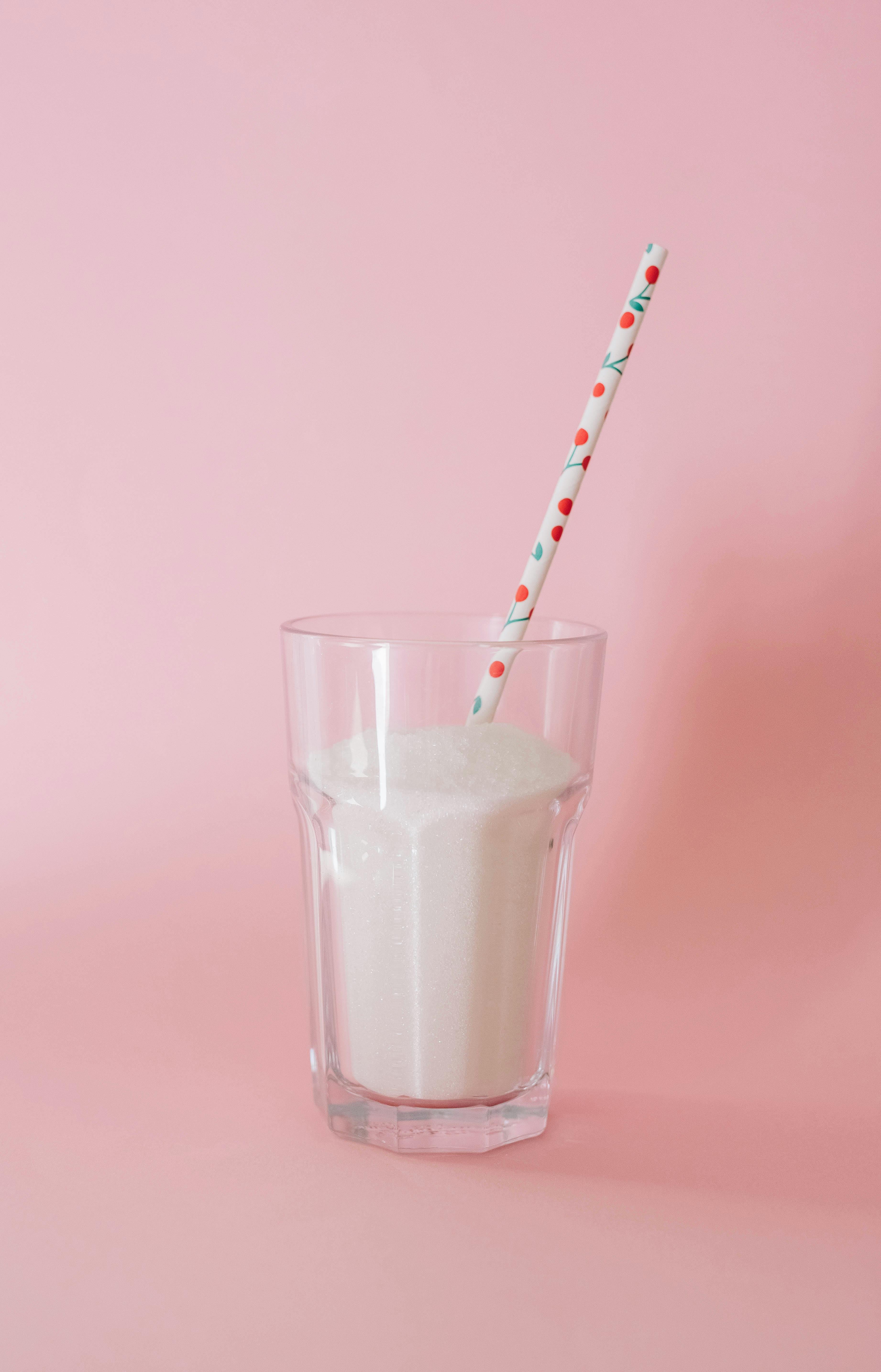Woman Pulling Straw out of Glass of Thick Milk Tea · Free Stock Photo
