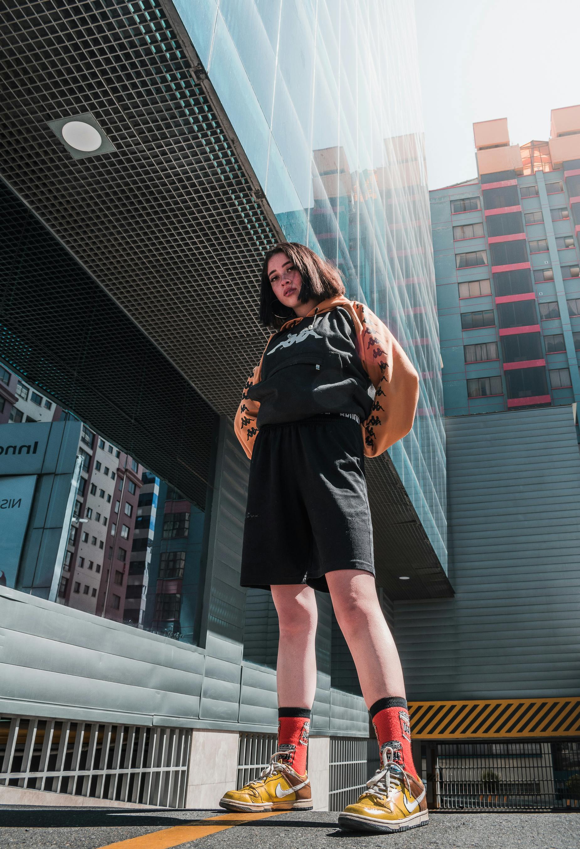 Low-Angle Shot of a Man in White Suit Posing on the Stairs · Free Stock ...