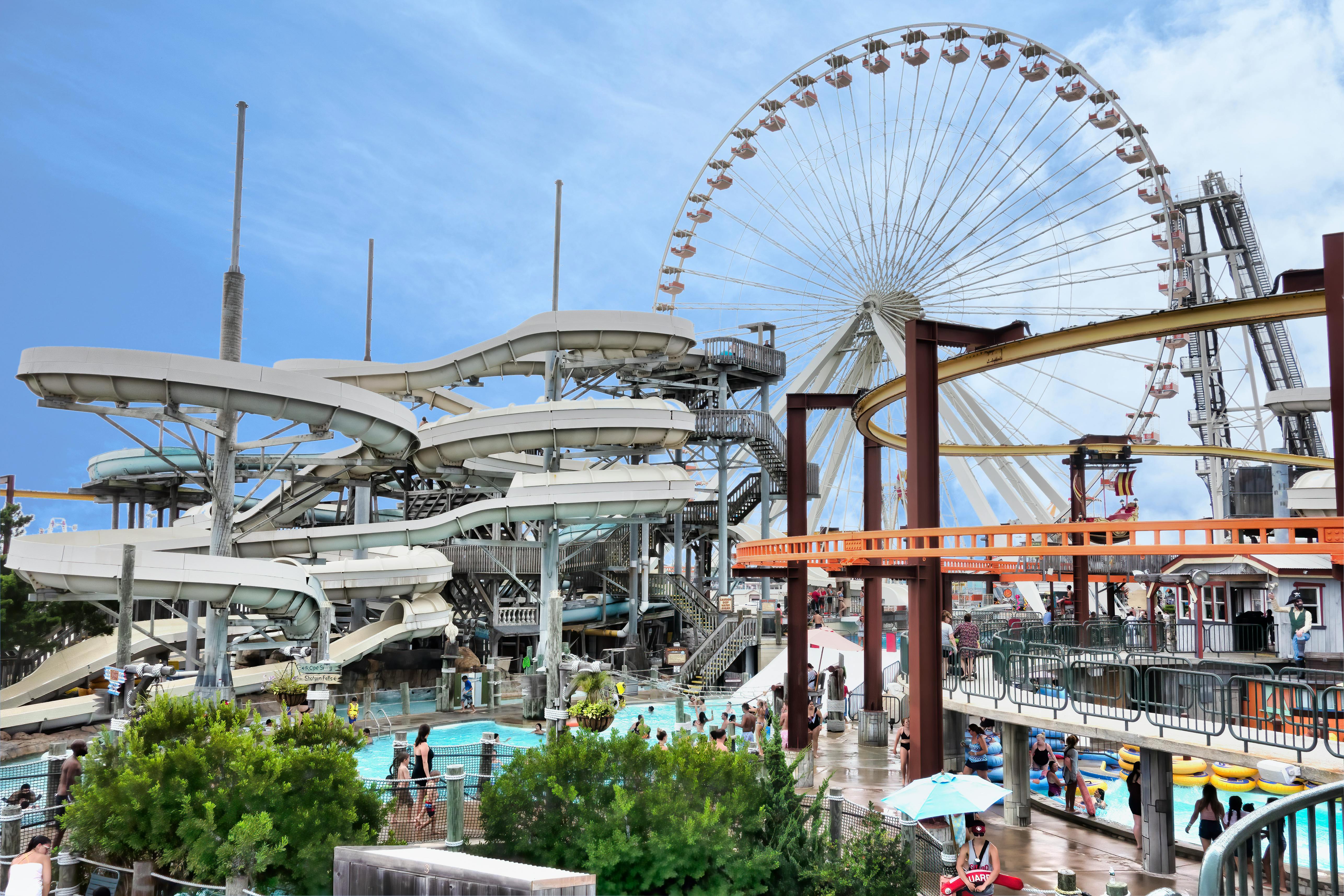 A Water Park with a Ferris Wheel · Free Stock Photo