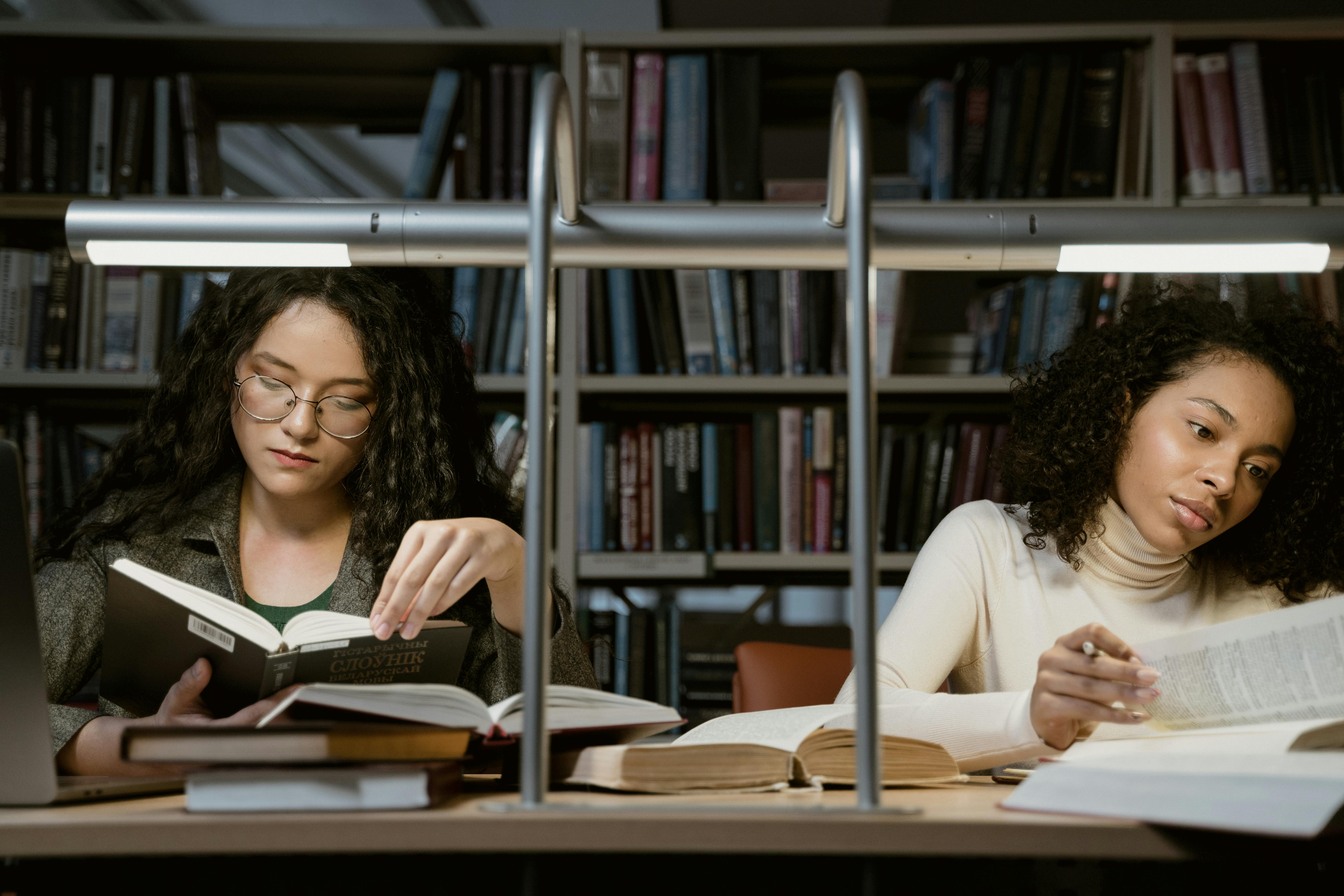 Women Reading Books in a Library · Free Stock Photo
