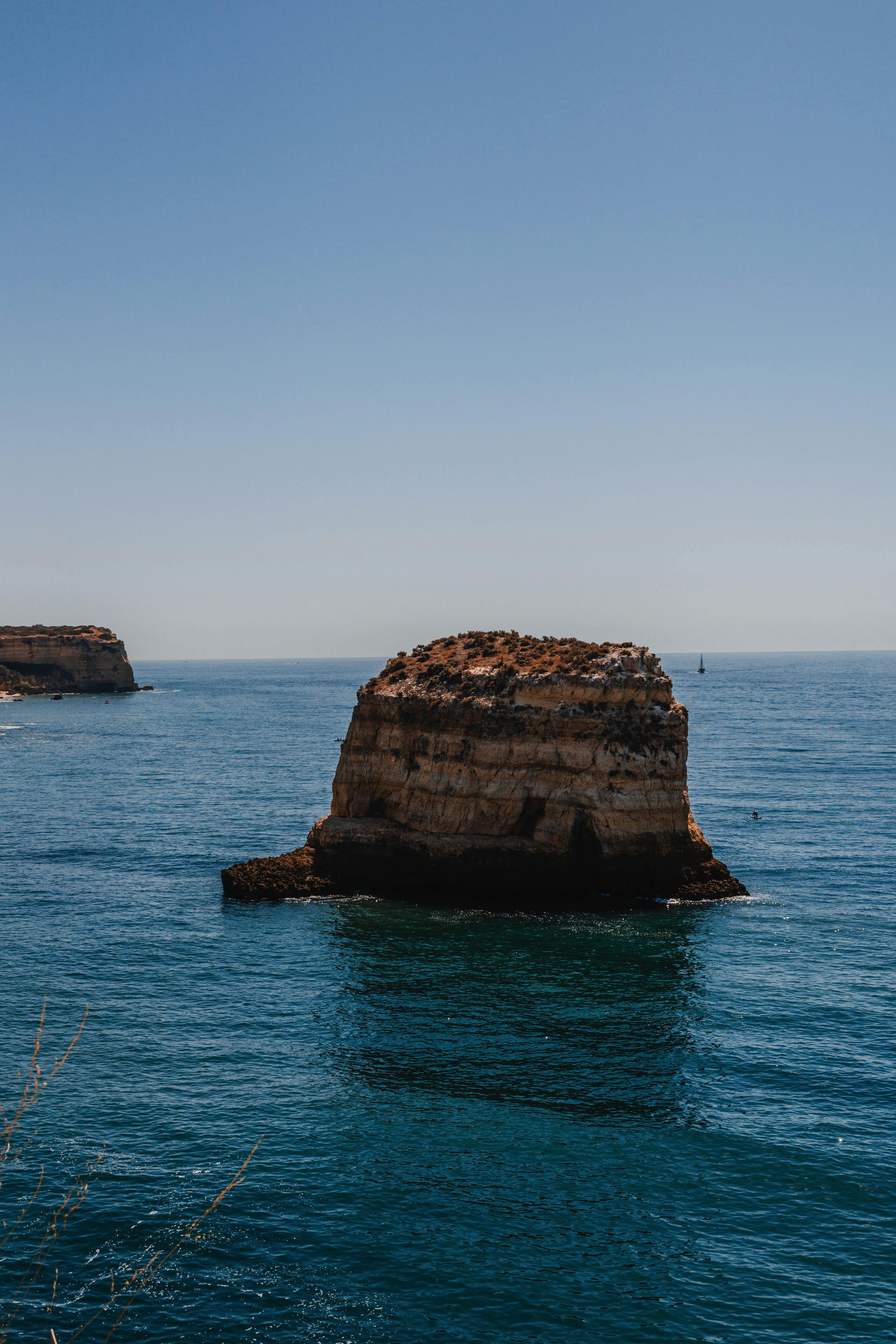 A Big Rock Formation in the Sea · Free Stock Photo