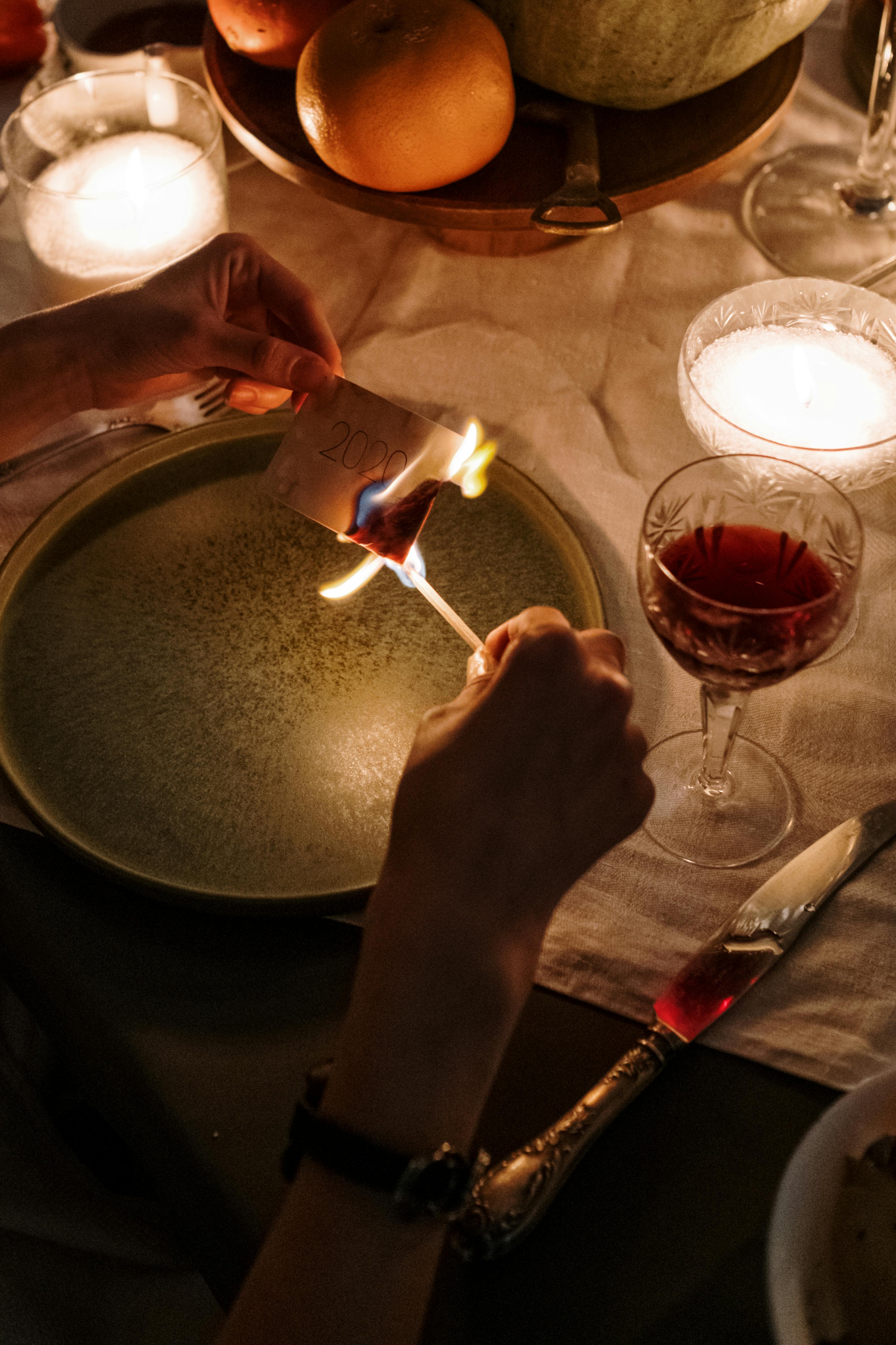 Person Burning a Piece of Paper · Free Stock Photo