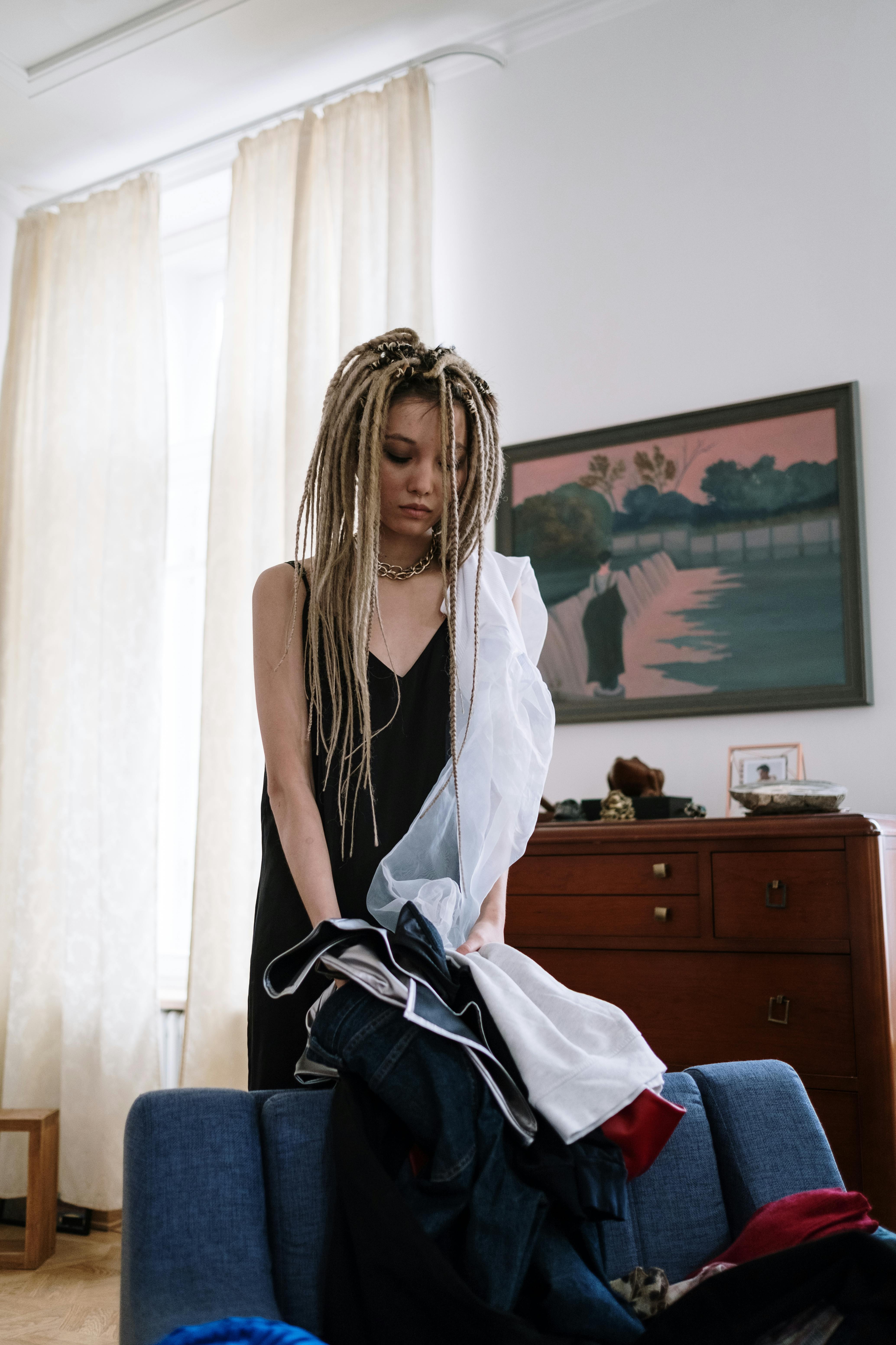 Confused Woman Looking at Papers · Free Stock Photo