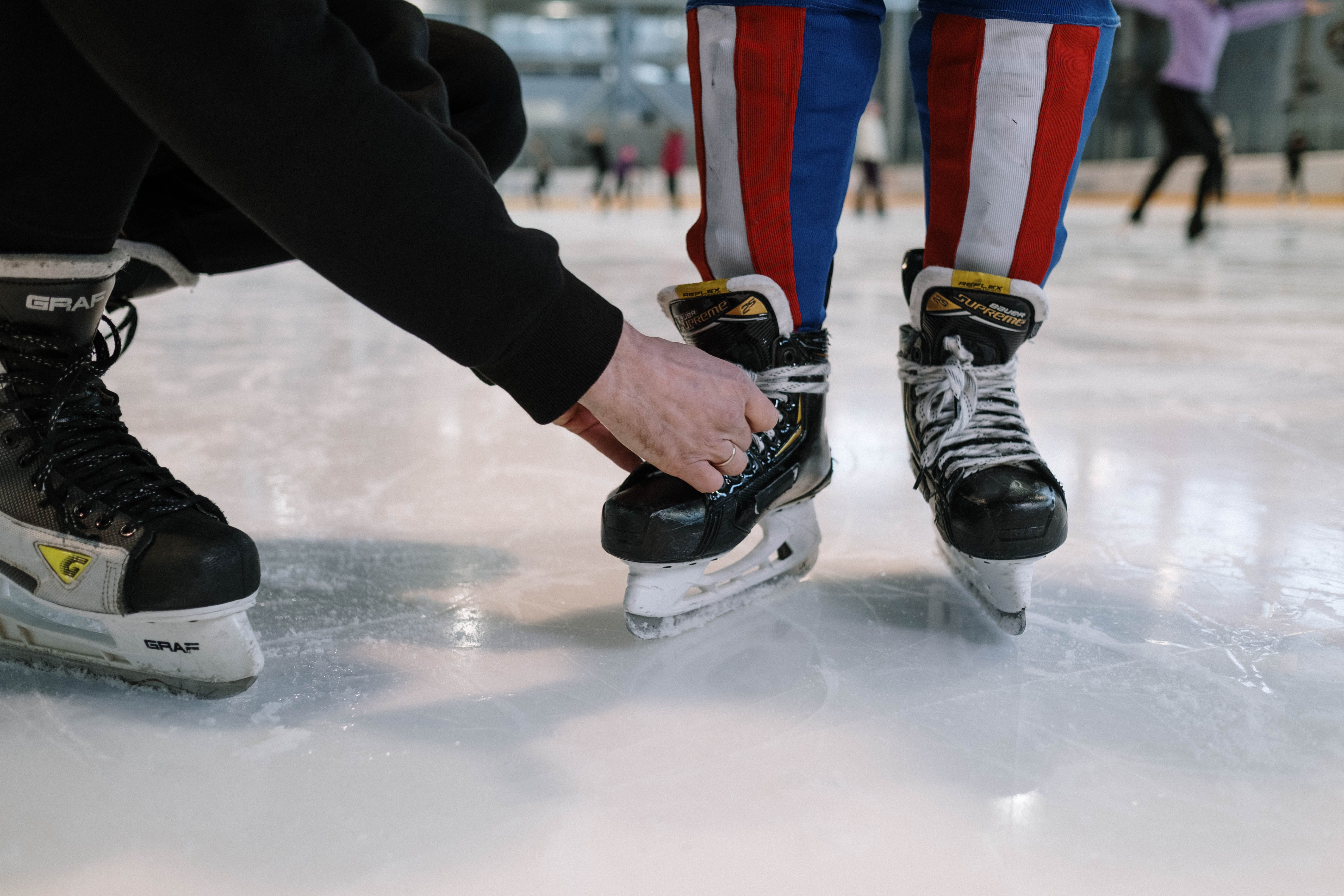 Ice Skaters Practicing in an Ice Skating Rink · Free Stock Photo