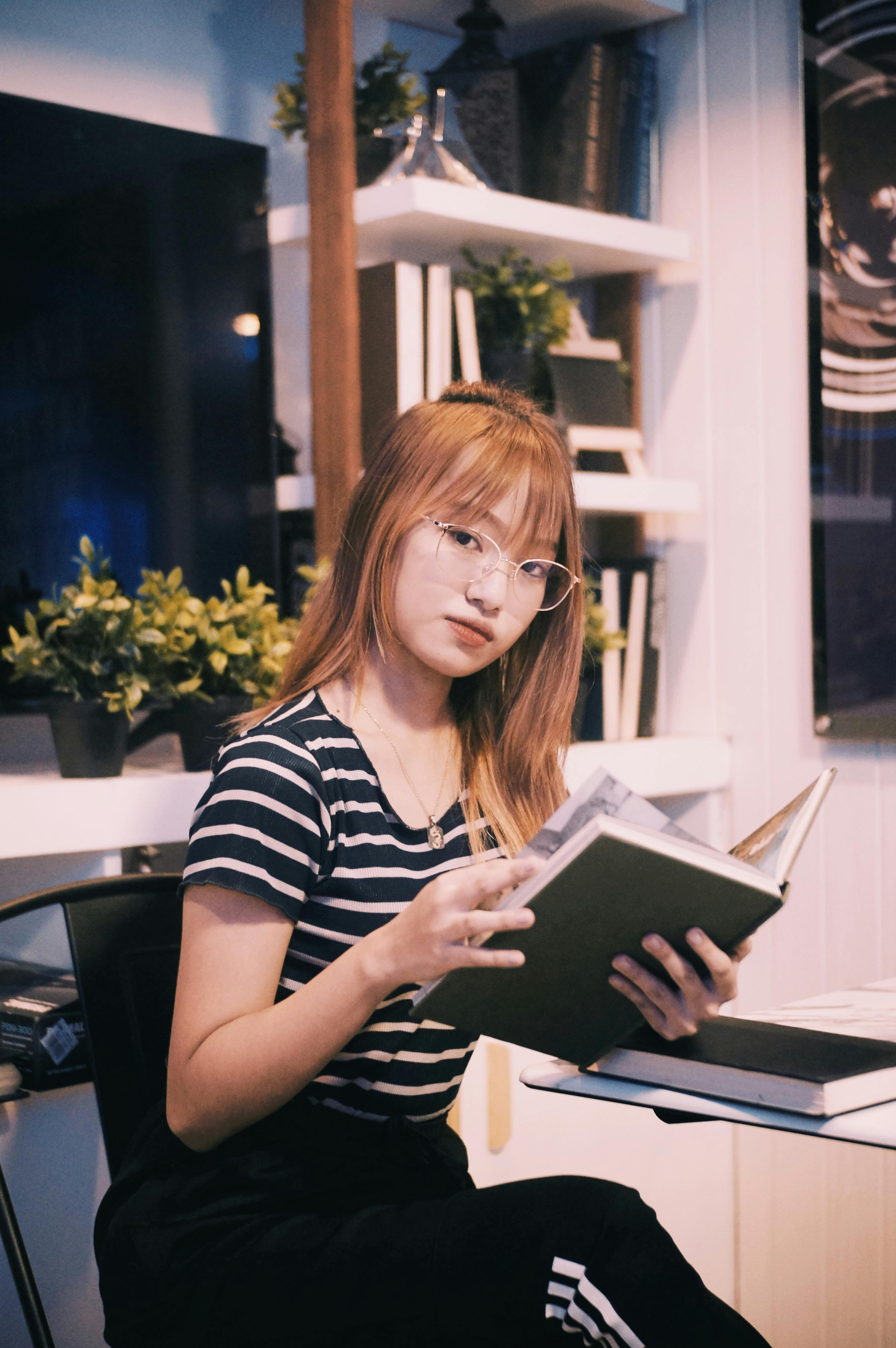 Selective Focus Photo of Woman Reading Book · Free Stock Photo